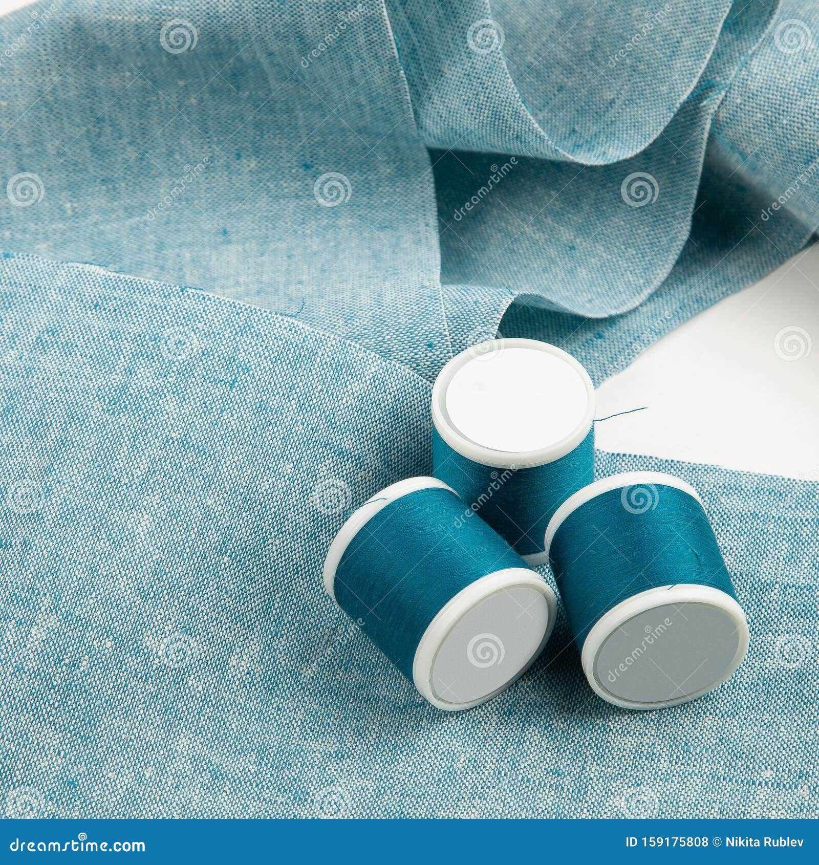 Blue Fabric with Spool of Sewing Thread Stock Photo - Image of clothes ...