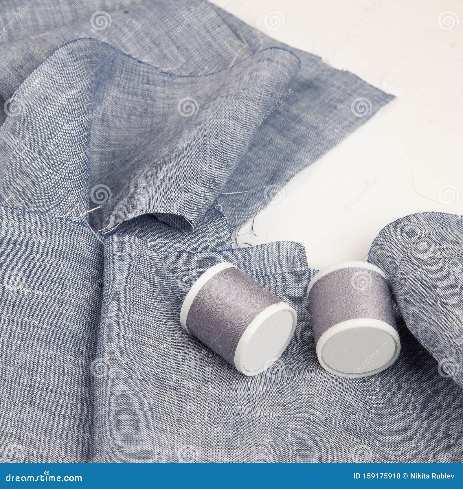 Blue Fabric with Spool of Sewing Thread Stock Photo - Image of needle ...