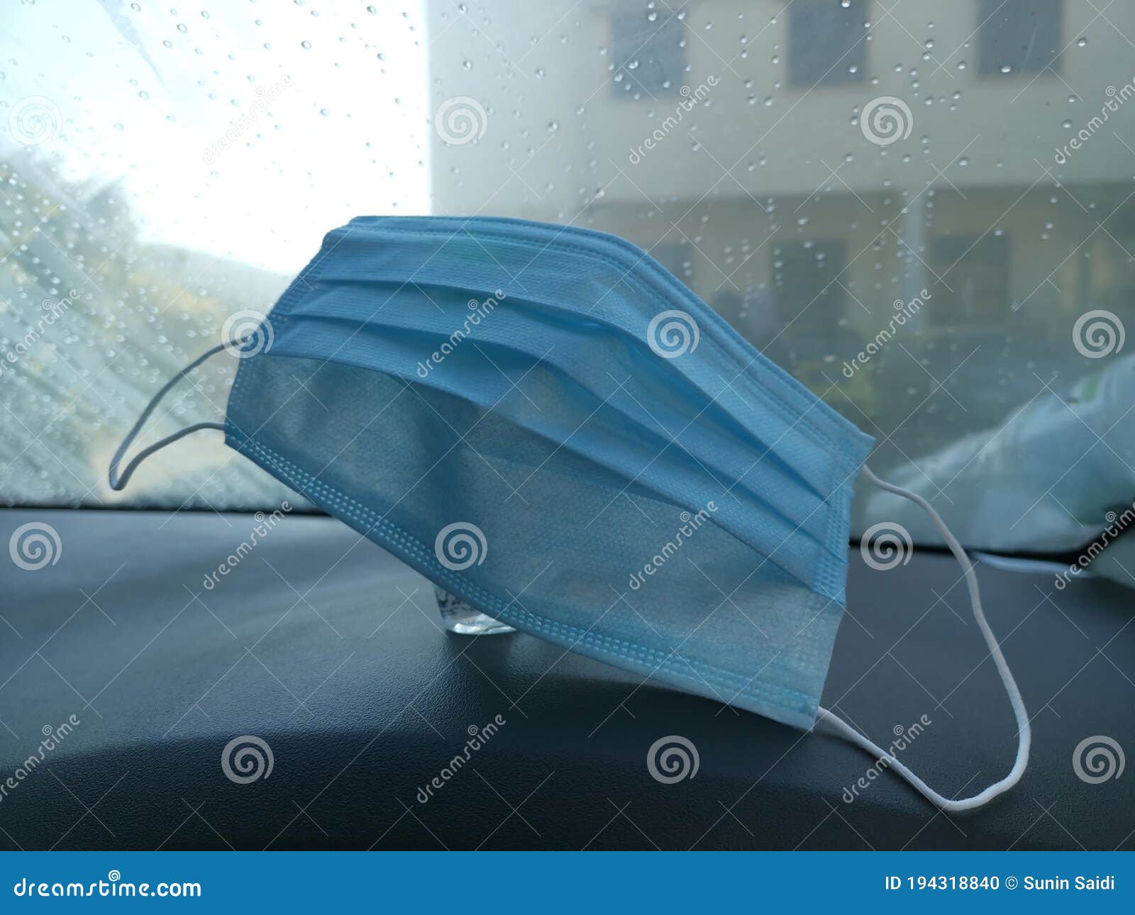 A Blue Face Mask on Car Dashboard. Stock Photo - Image of textile ...