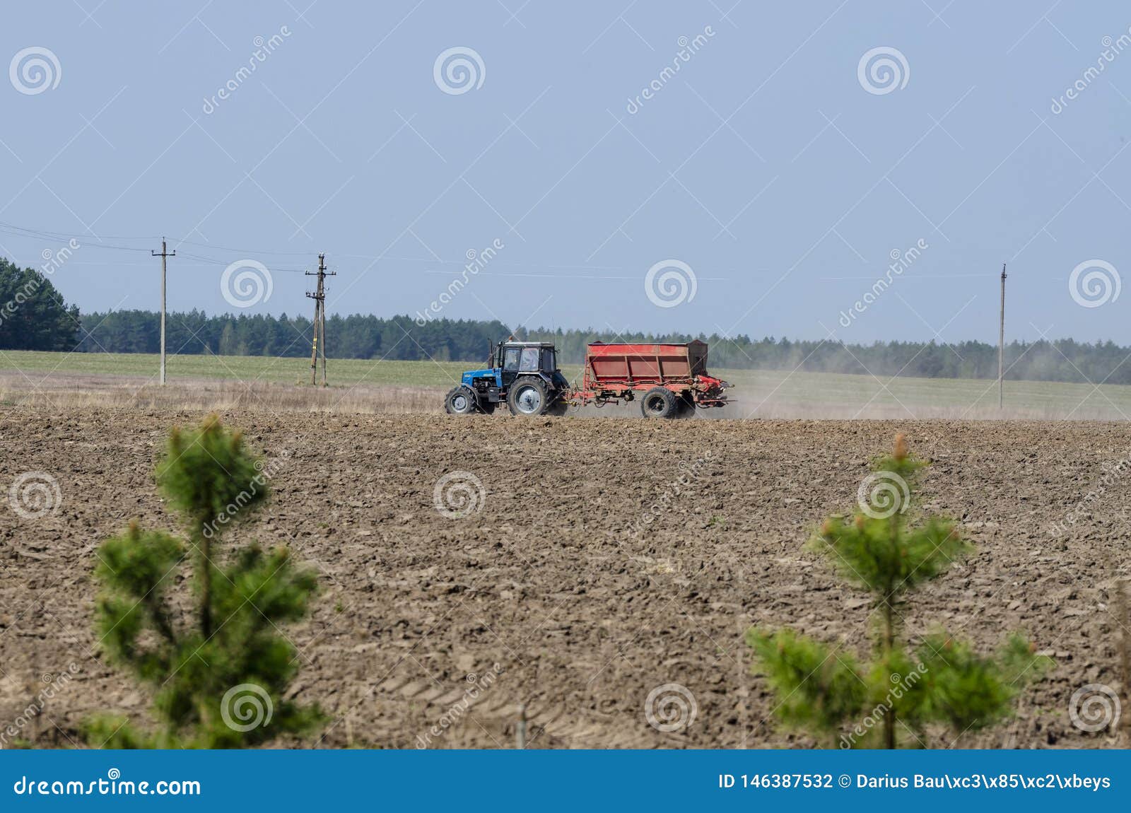 Blue Farm Tractor Fertilize the Field Stock Photo - Image of tree ...