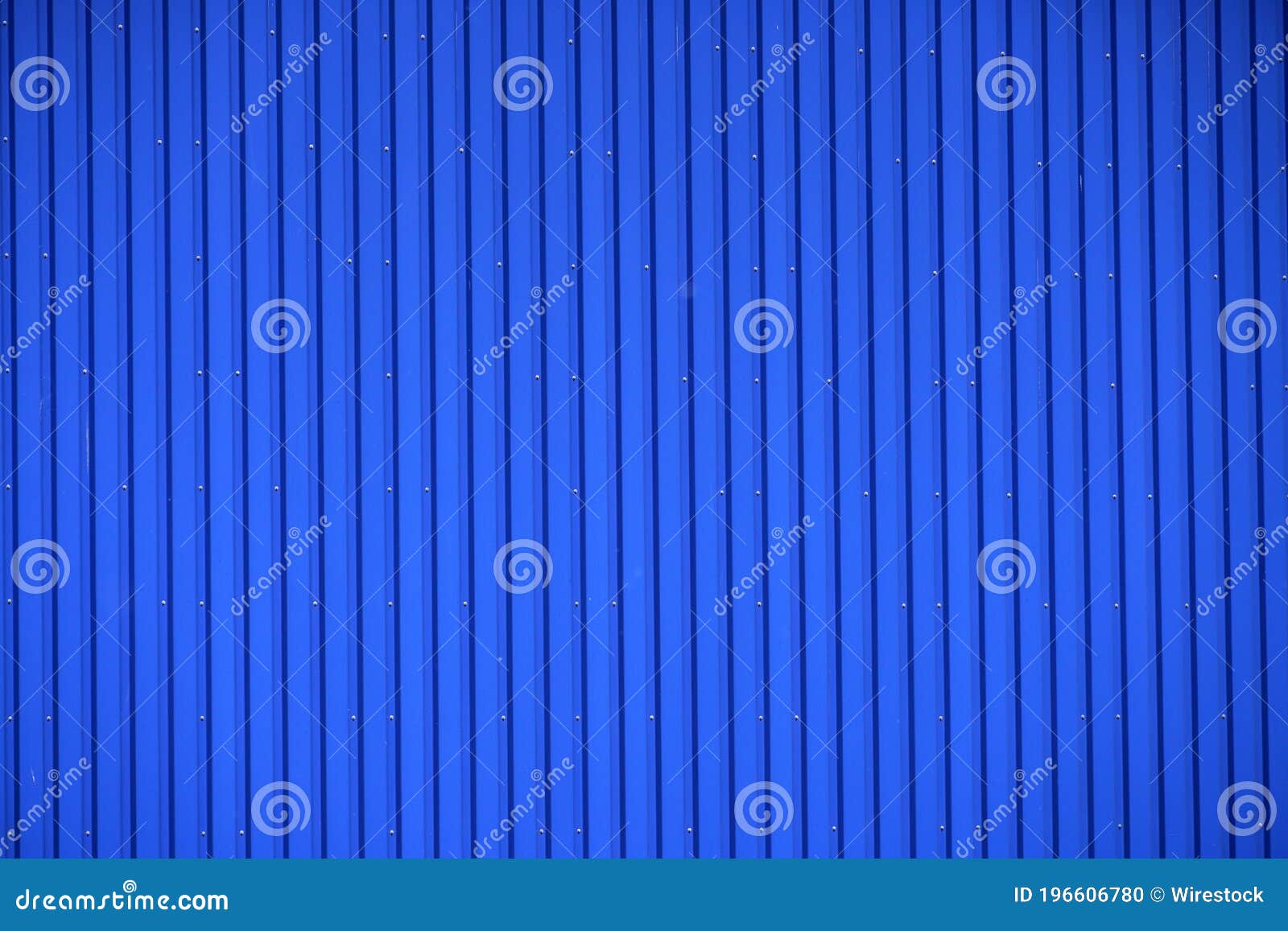 Blue Fence Made of a Profiled Sheet on a Stone Wall Stock Photo - Image ...