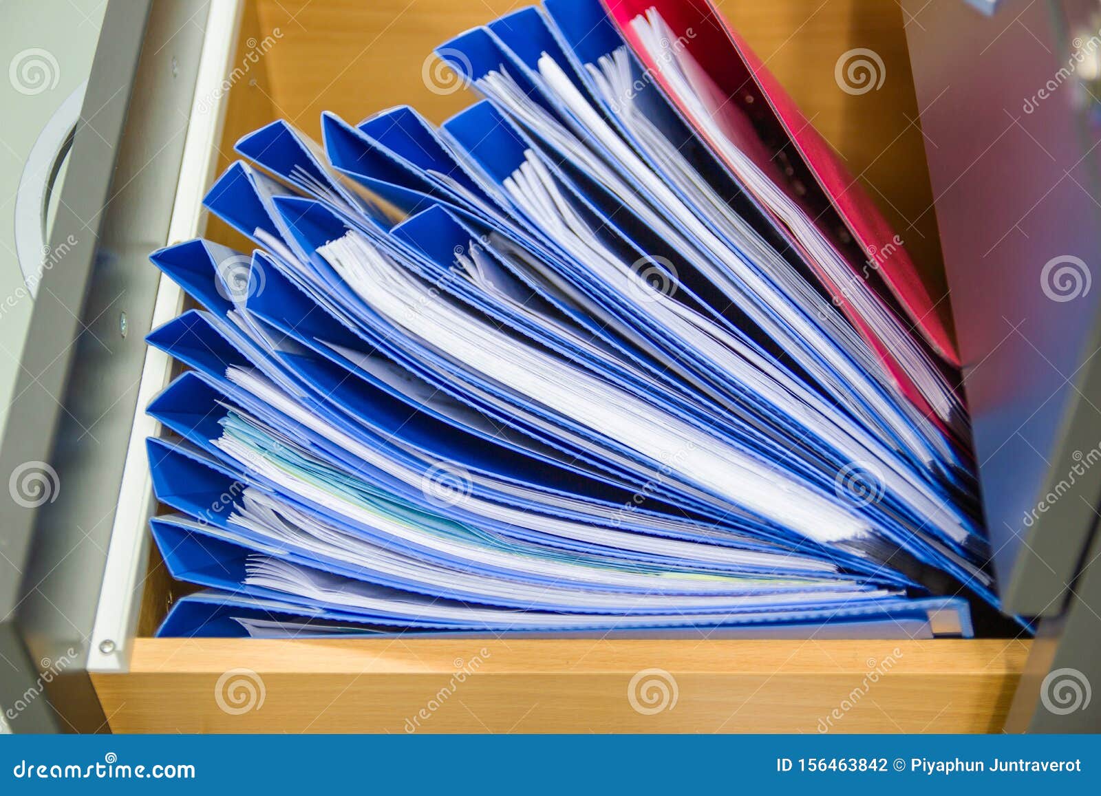 Blue File Folder Documents in a File Cabinet Retention Stock Photo ...