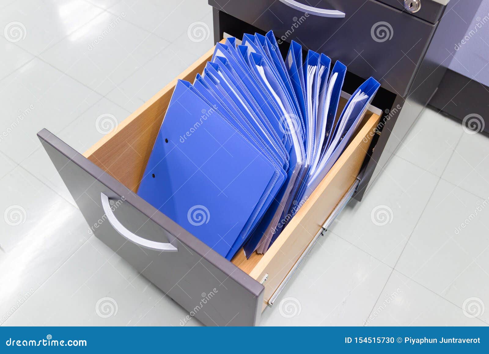 Blue File Folder Documents in a File Cabinet Retention Stock Photo ...