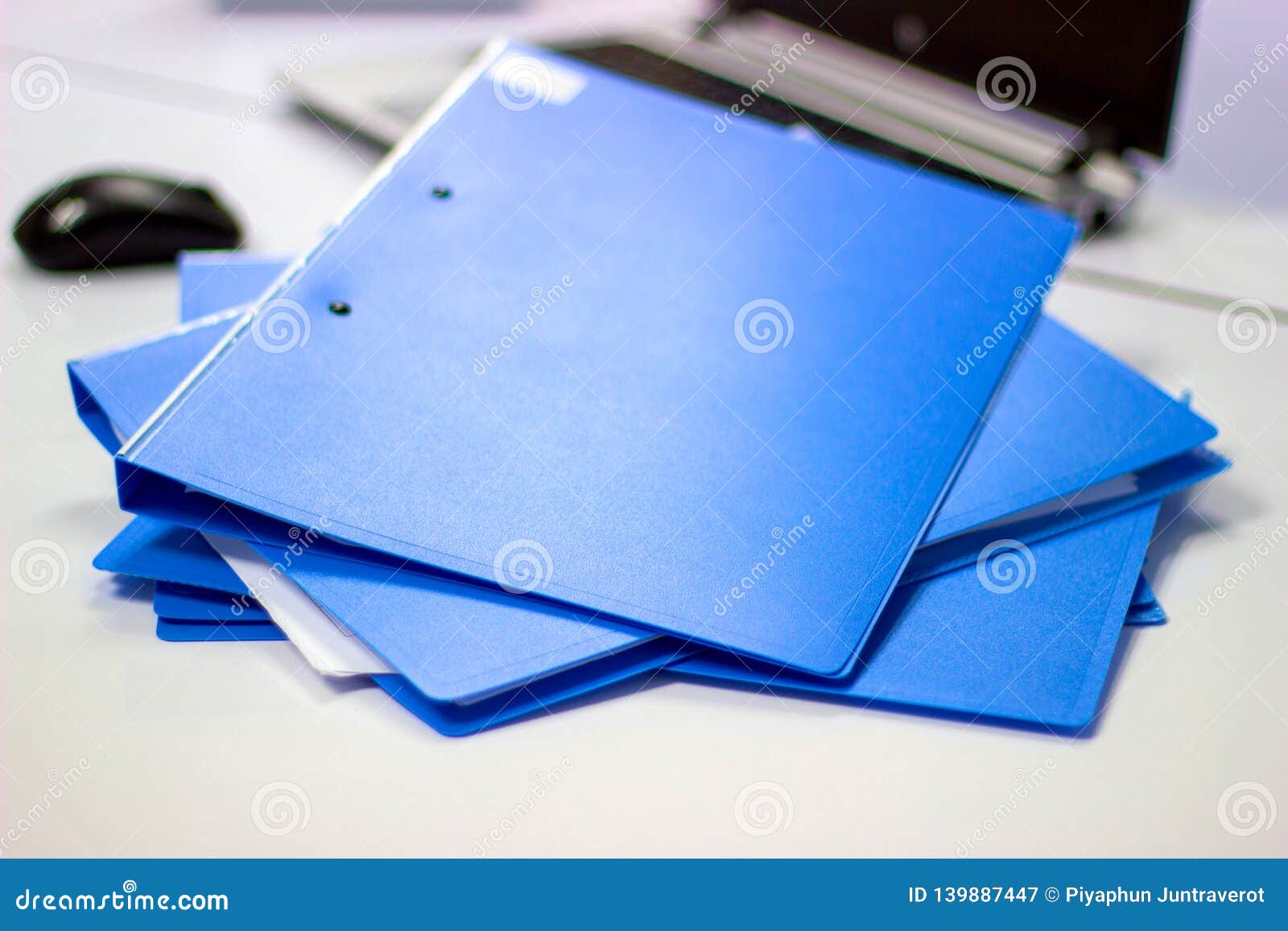 Blue File Folder with Documents and Notebook on the White Table Stock ...