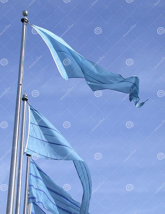Blue flags on a blue sky stock image. Image of breezey, aqua - 3413