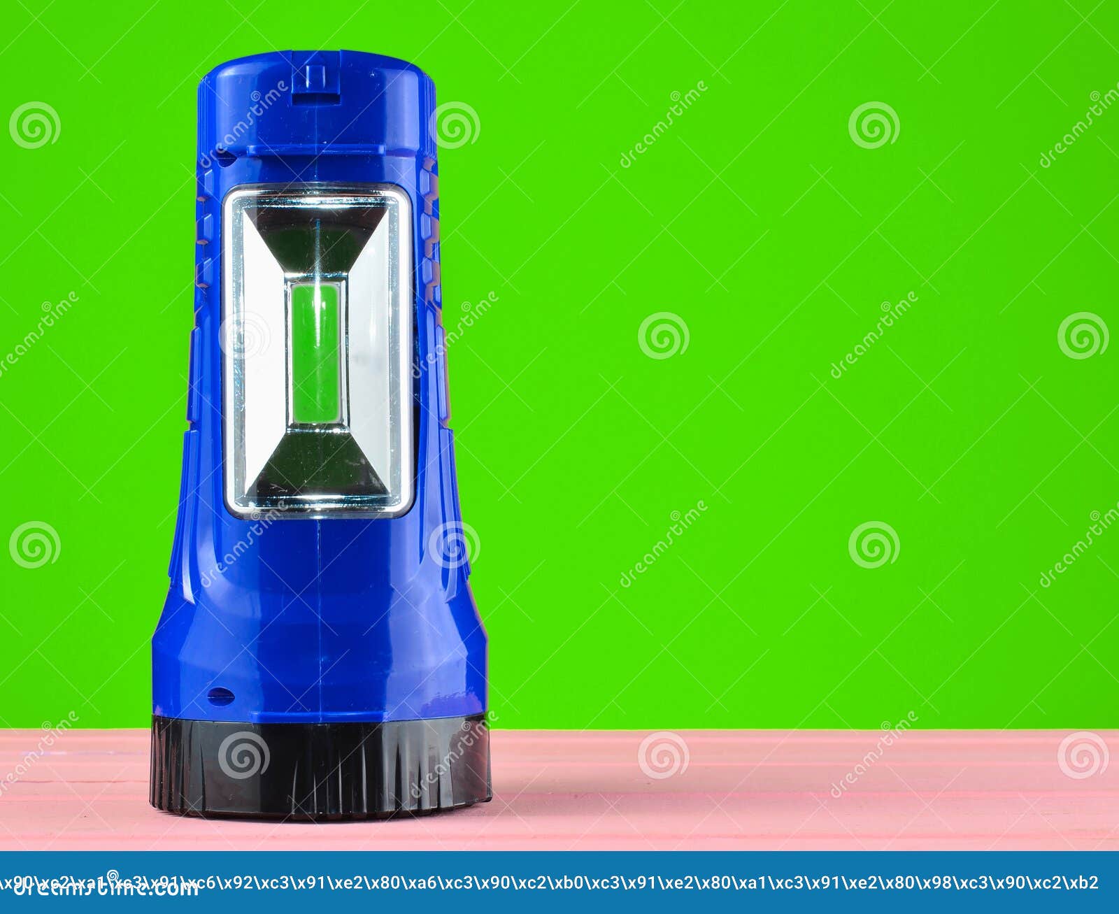 Blue Flashlight Projector Lies on a Desk Isolated on a Yellow Wall ...