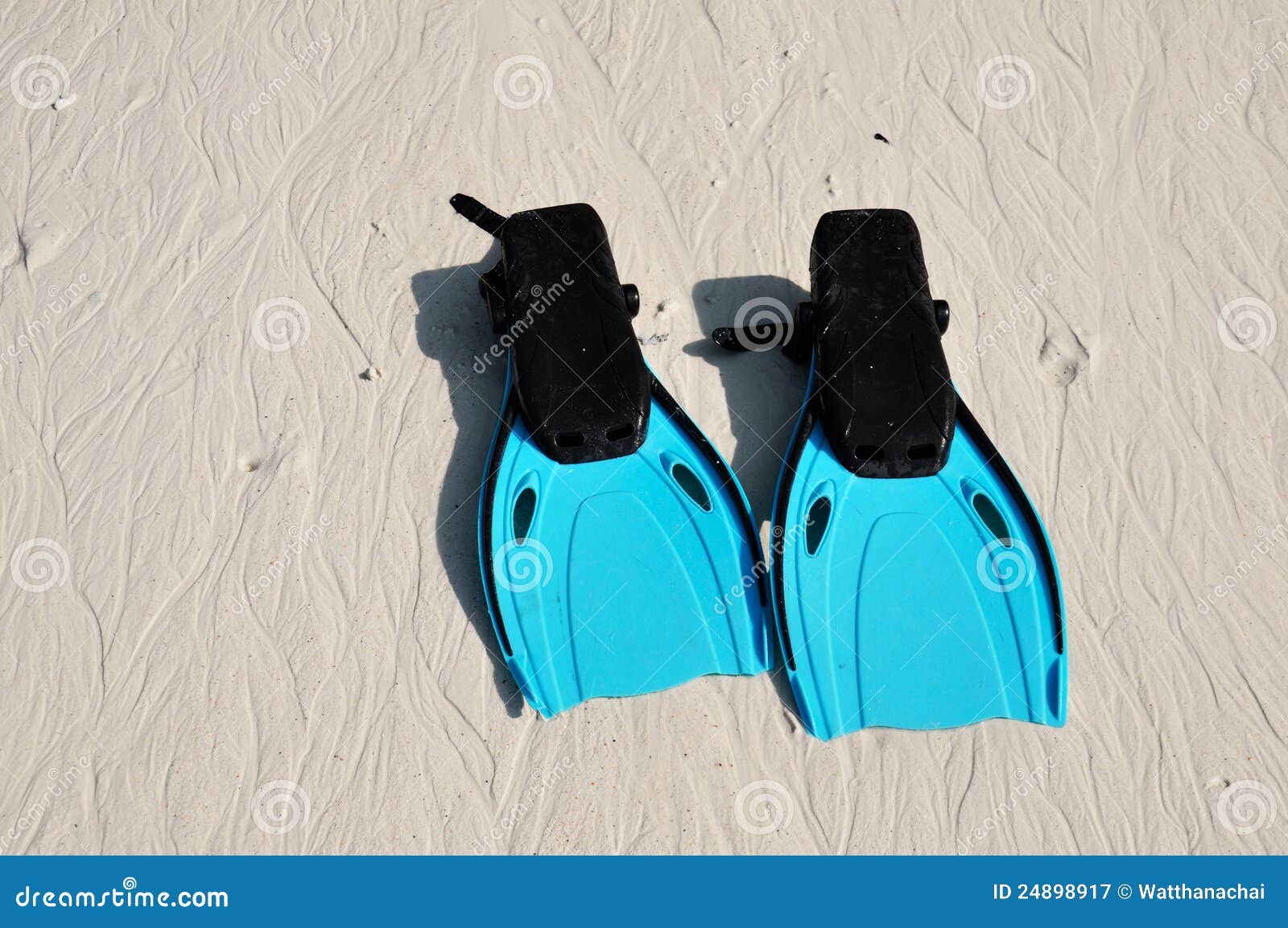 Blue flippers on the beach stock image. Image of black - 24898917