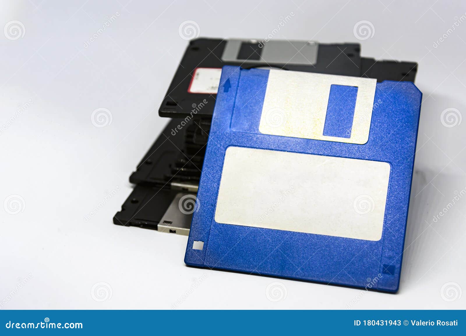 A Blue Floppy Disk With A White Sticky Label With A Bunch Of Other ...