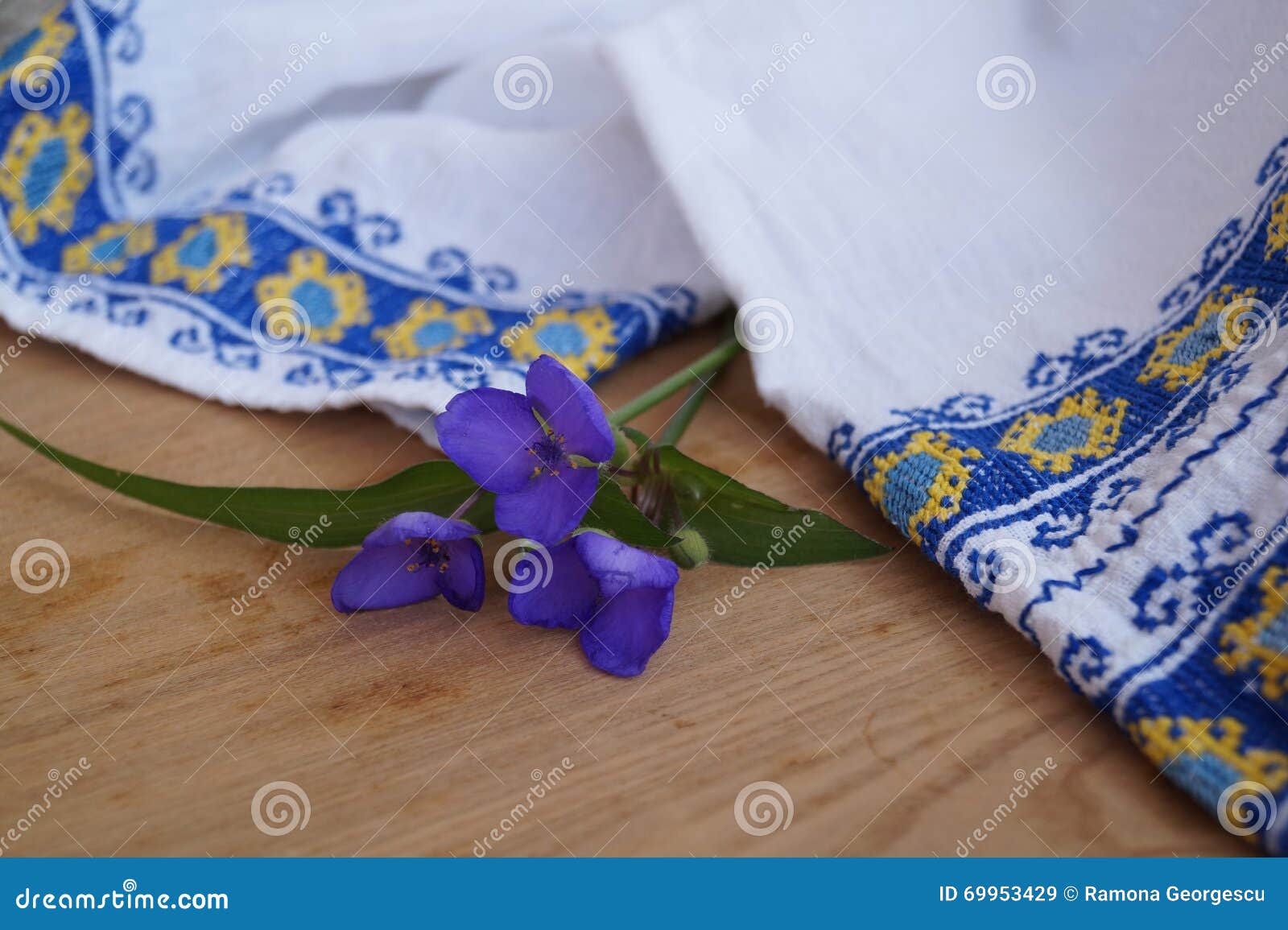 Blue flower and serviette stock image. Image of needlework - 69953429