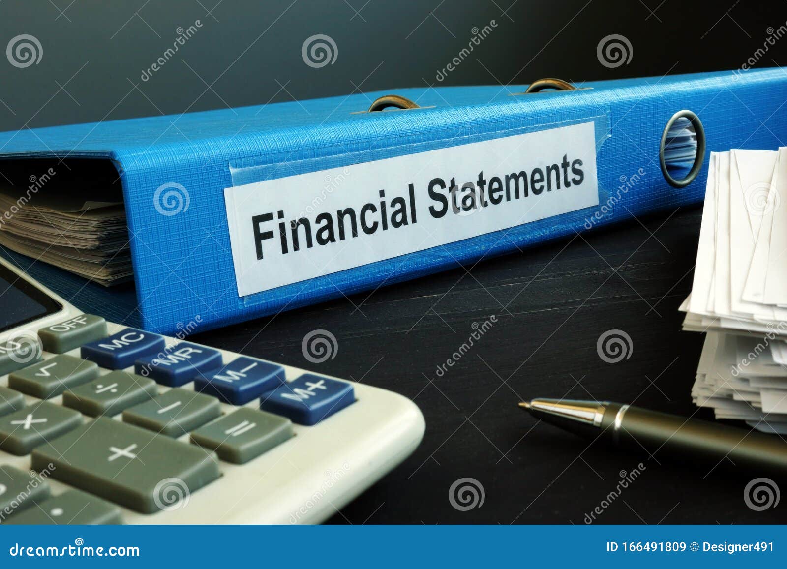 On Financial Statements And Charts There Is A Marker And A Sticker With ...