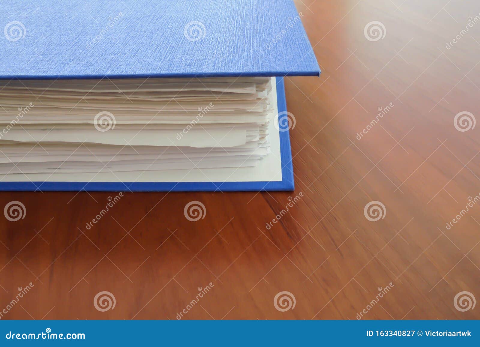 A Blue Folder with Papers Lies on the Table. Stock Image - Image of ...