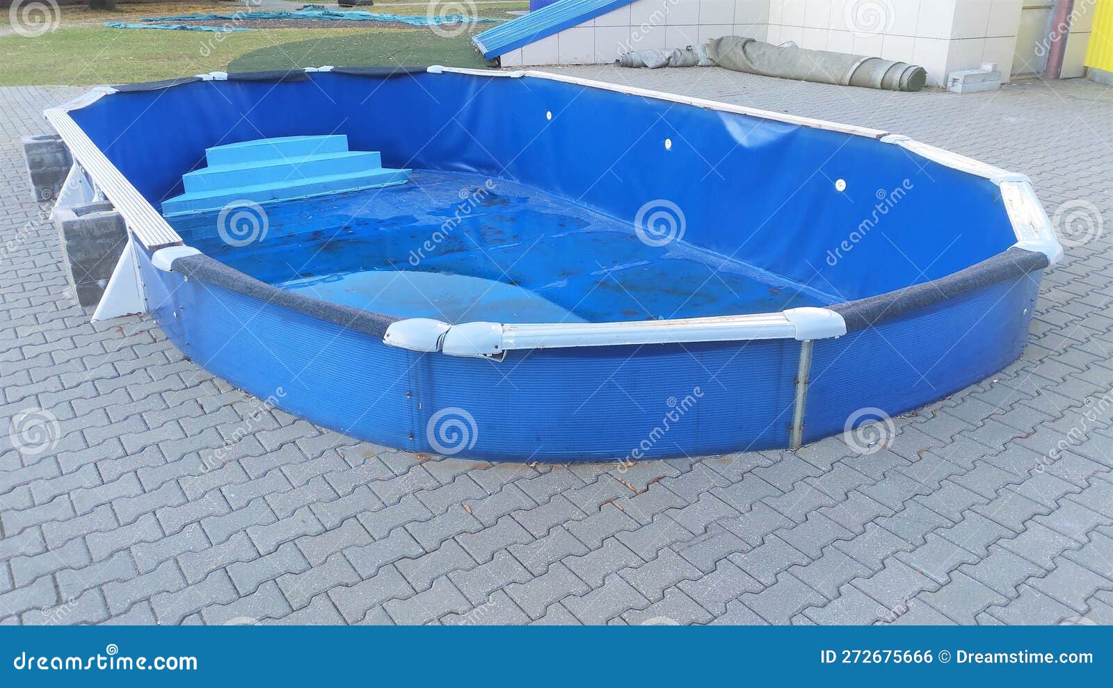 A Blue Frame Swimming Pool Made of PVC Fabric and Plastic is Located on ...