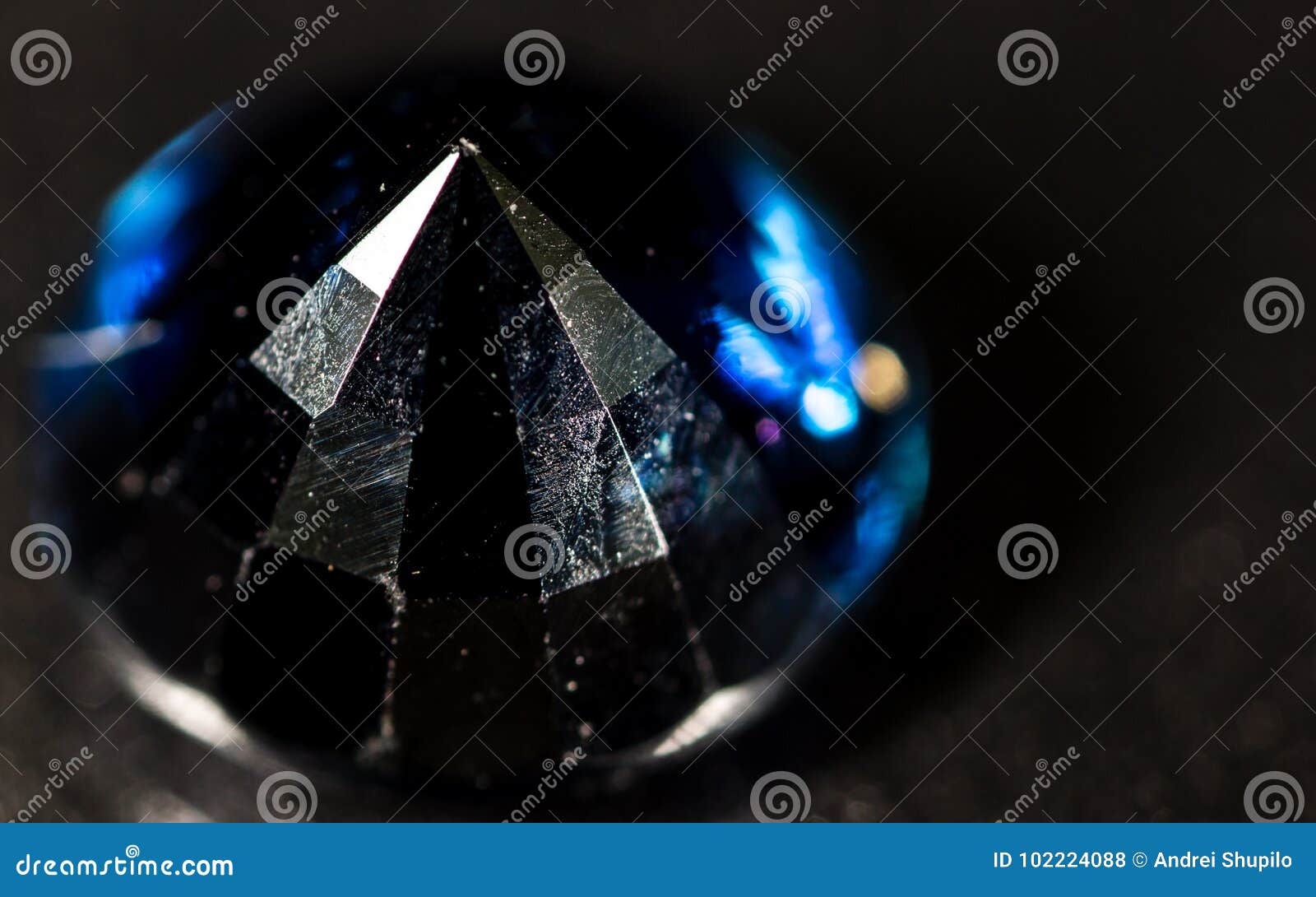 A Blue Gem on a Black Background Stock Photo - Image of closeup ...