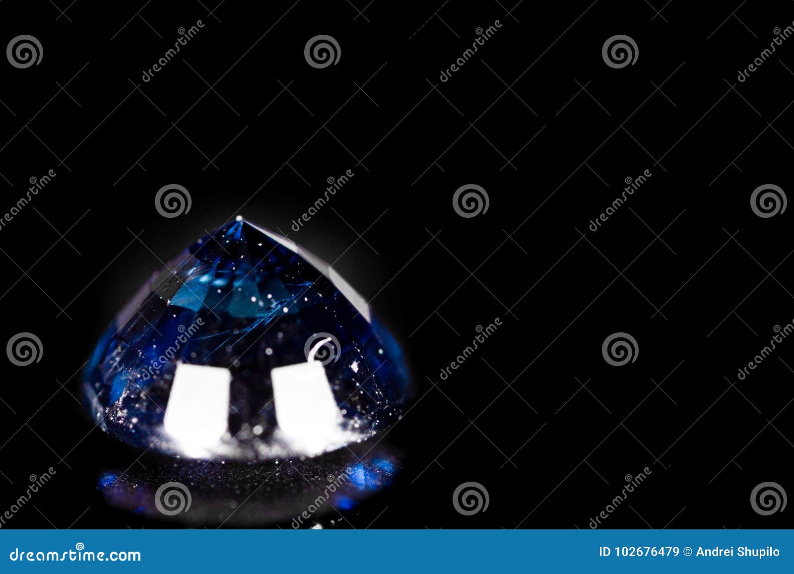 A Blue Gem on a Black Background Stock Image - Image of macro, isolated ...