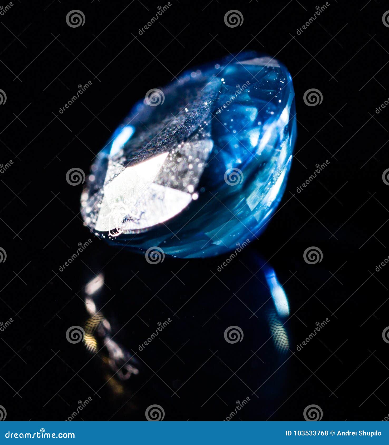 A Blue Gem on a Black Background Stock Photo - Image of clear, macro ...