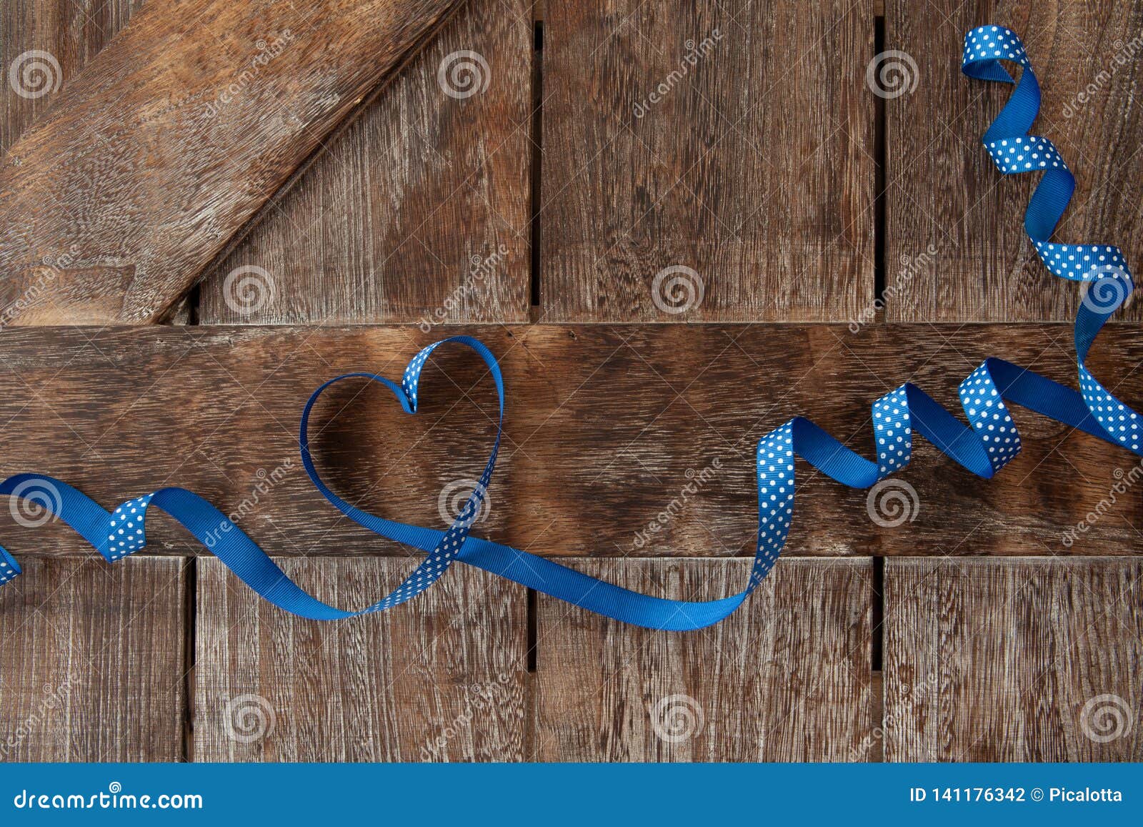 Blue Gift Ribbon in a Heart Shape Stock Photo - Image of relationship ...
