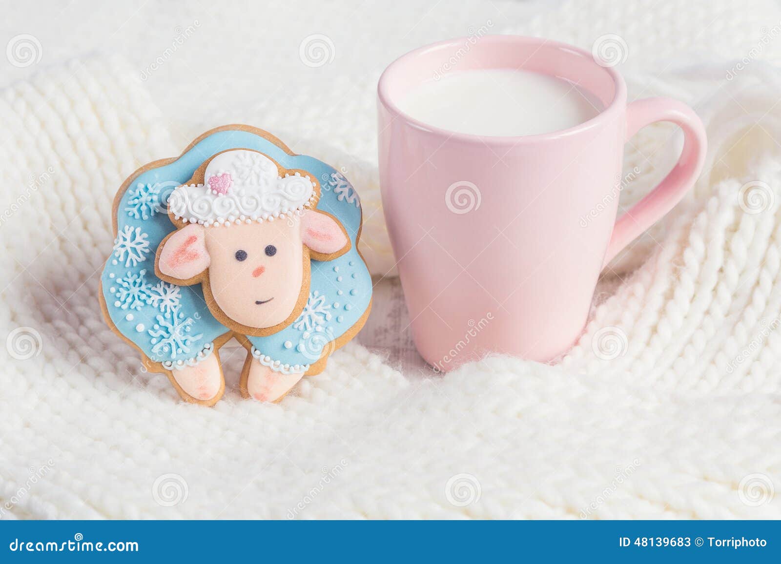 Blue Gingerbread Sheep with Cup of Milk on White Knitted Background ...