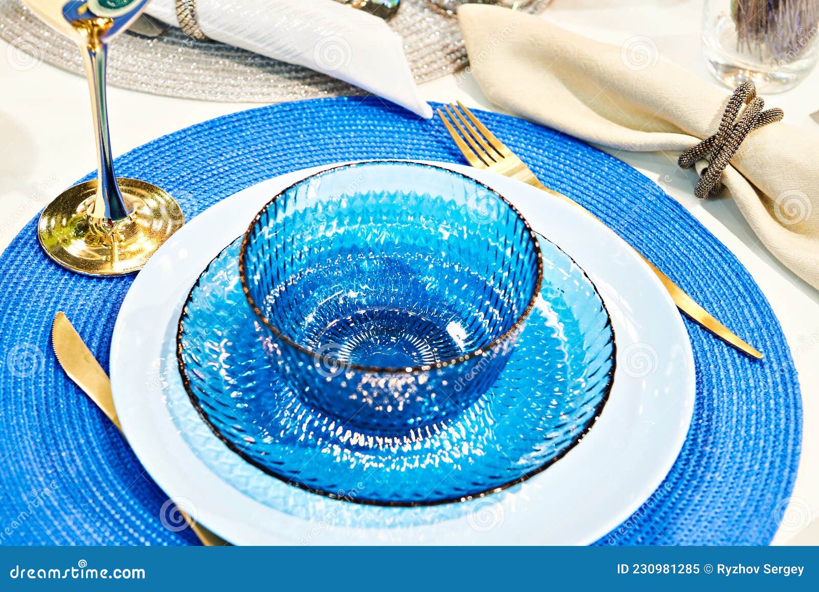 Blue glass plate on table stock image. Image of catering - 230981285