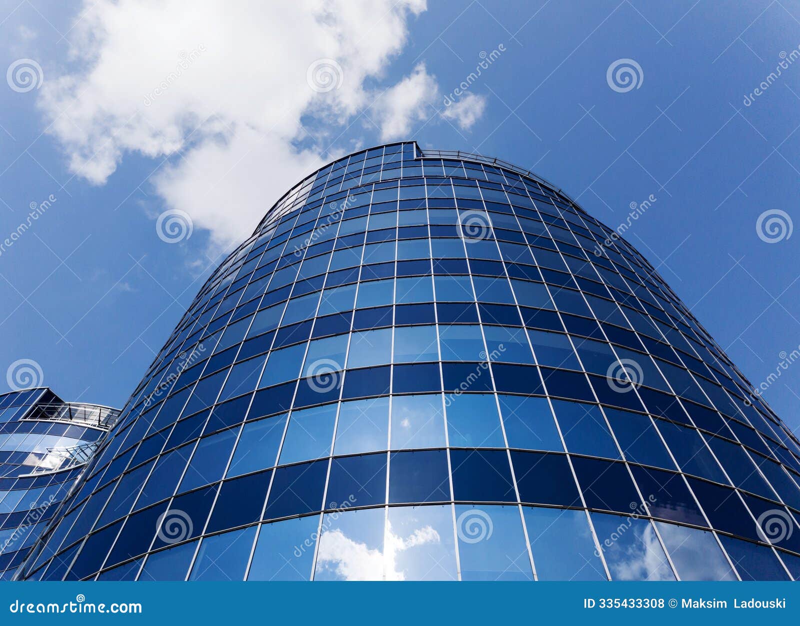 Blue glass skyscraper stock photo. Image of cloud, colourful - 335433308