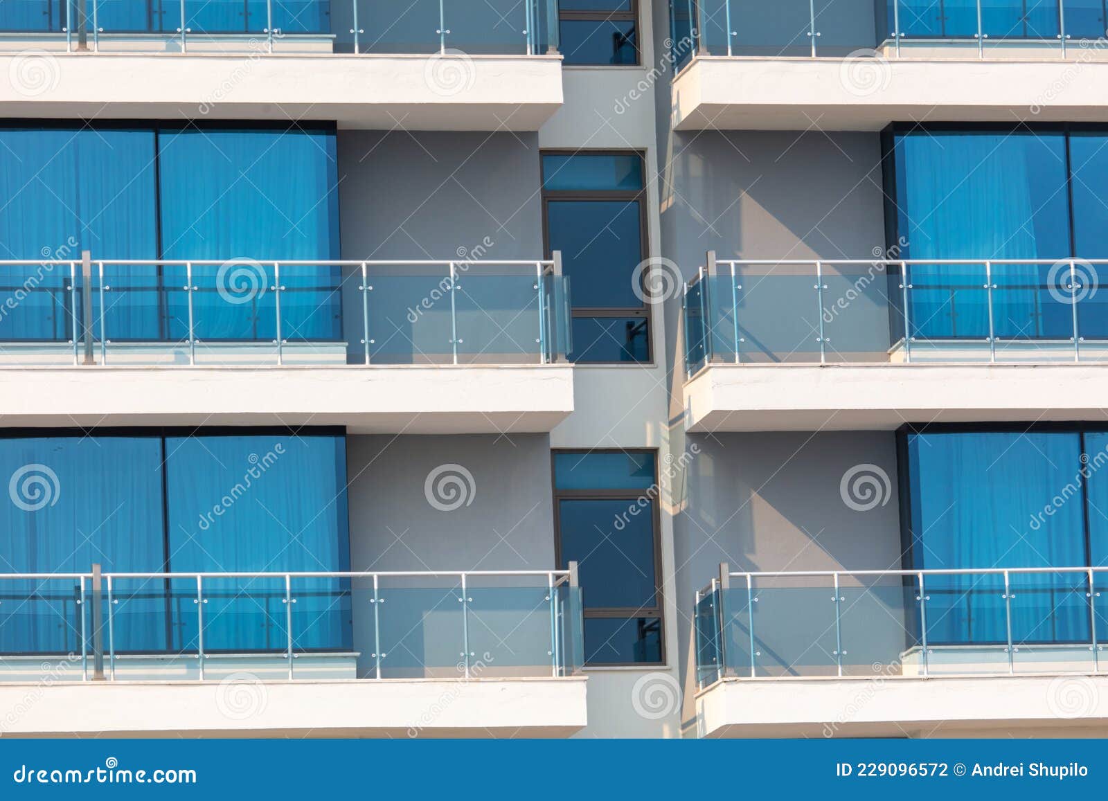 Blue Glass on the Windows in the Building Stock Photo - Image of ...