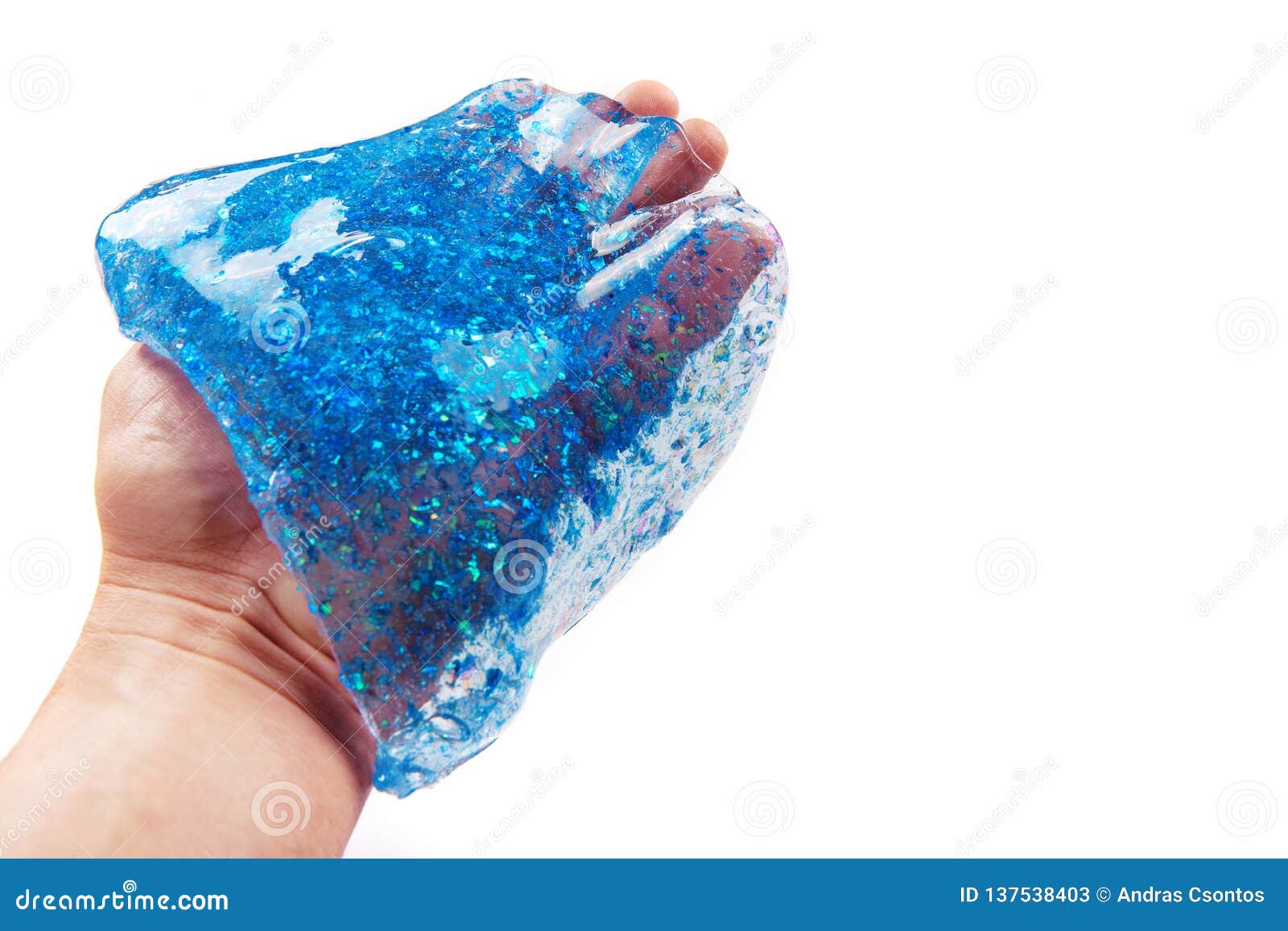 Blue glitter slime on hand stock image. Image of white - 137538403