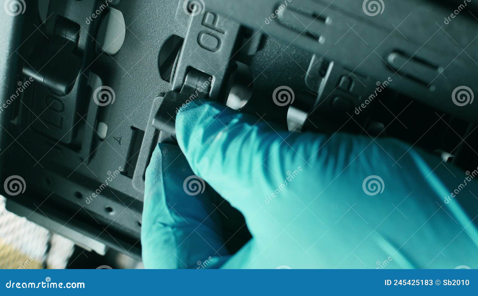 A Blue Gloved Hand Opens the Switches from the Lock To the Open ...