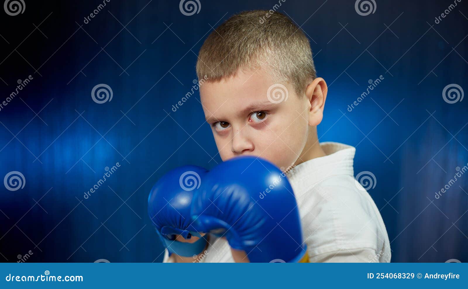 On Blue Gradient Background, an Athlete with Blue Overlays on His Hands ...