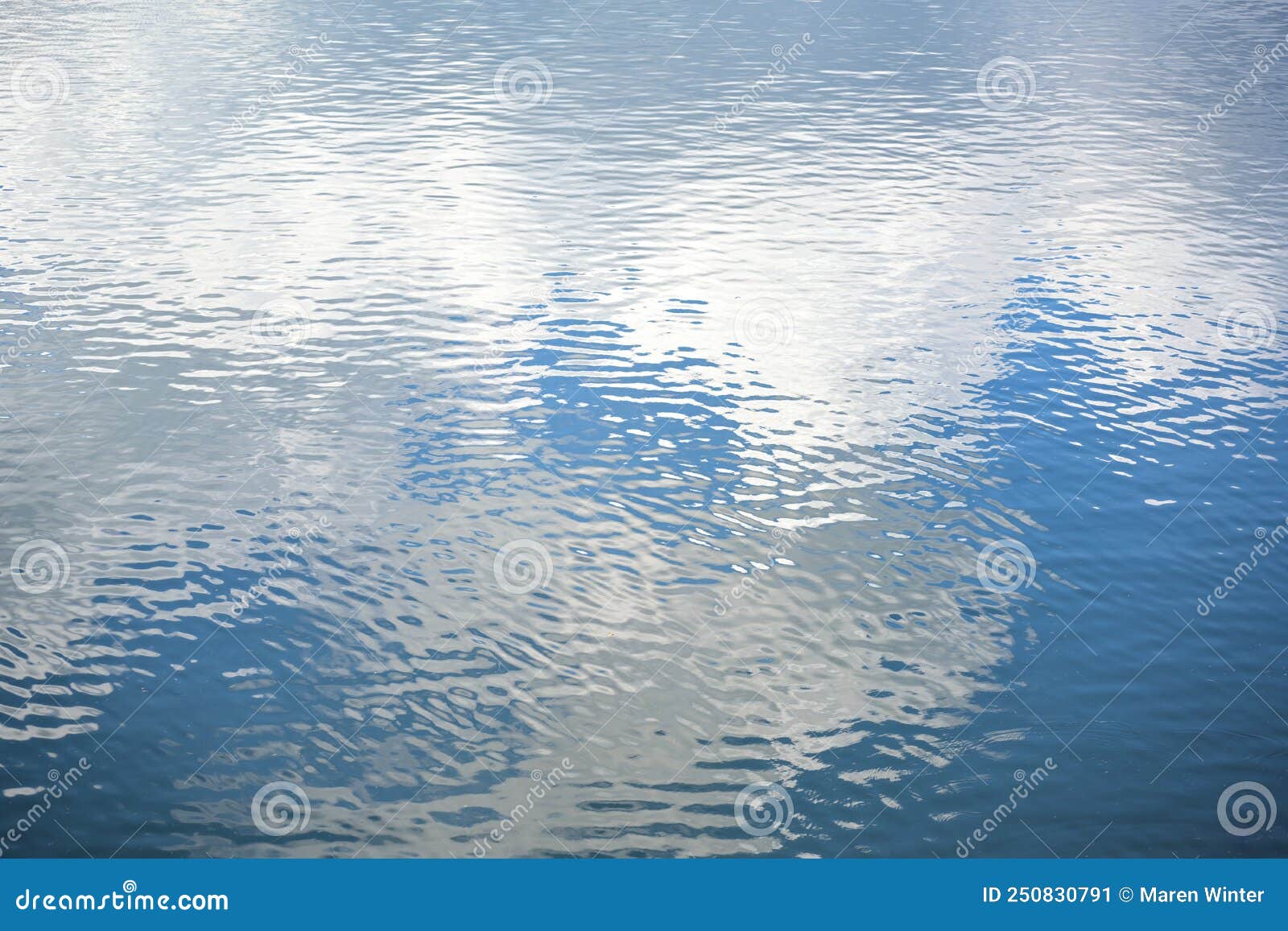 Blue Gray Water Surface with Very Small Waves and Reflection of the ...