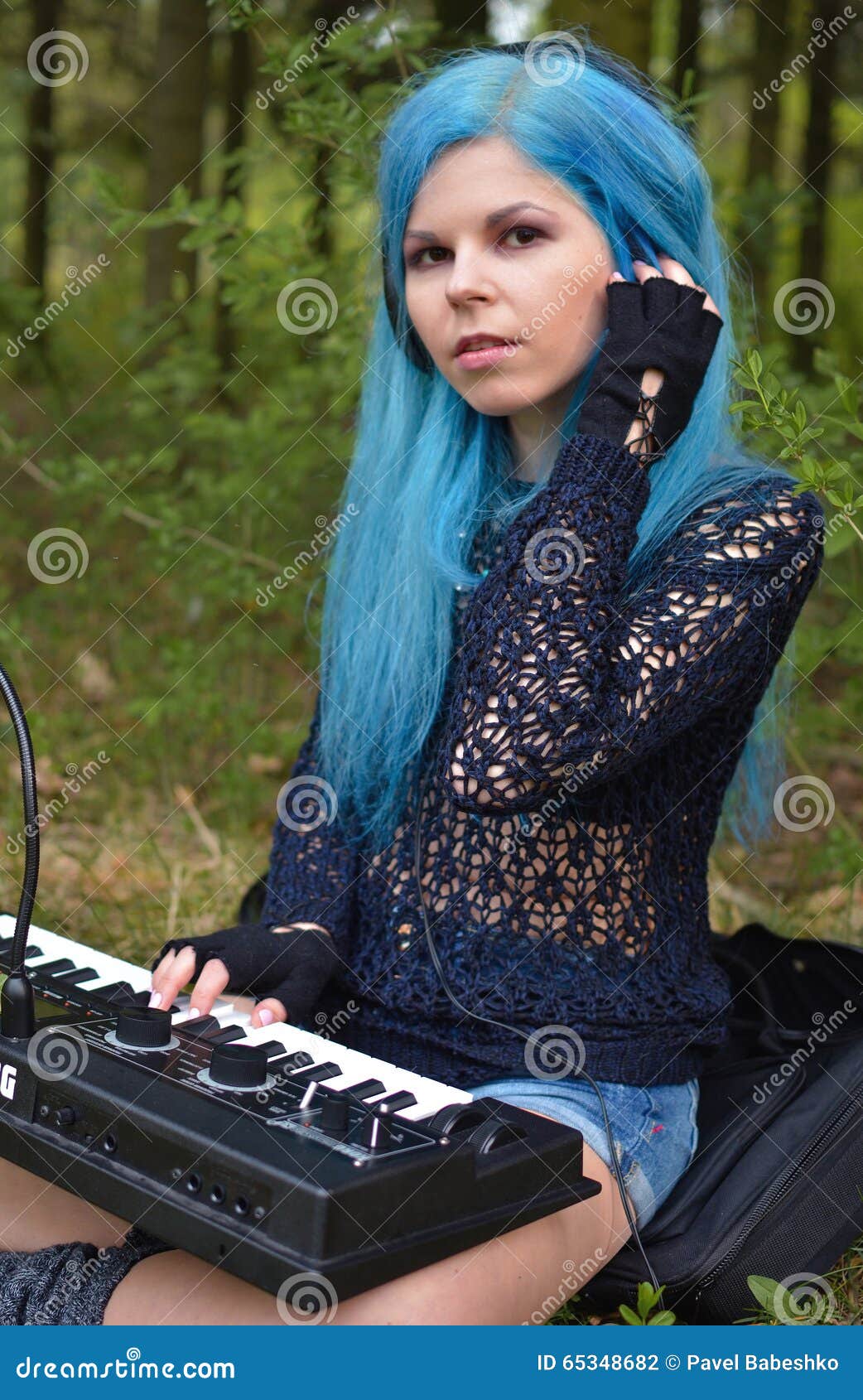 Blue-haired musician girl stock photo. Image of keys - 65348682