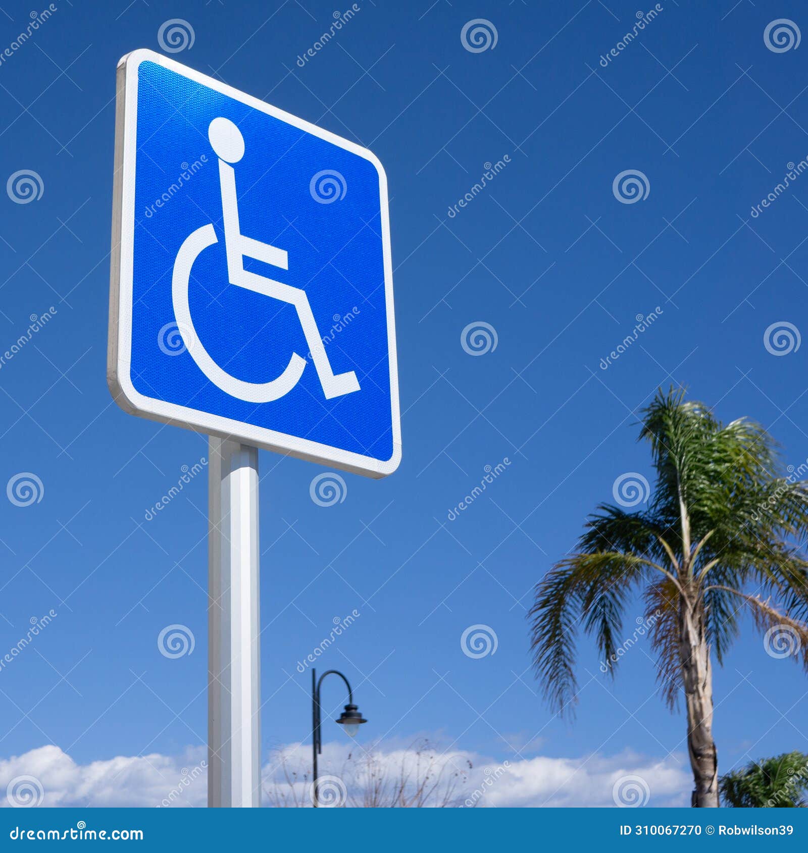 Blue Handicapped Parking Sign with Blue Sky Background Stock Photo ...