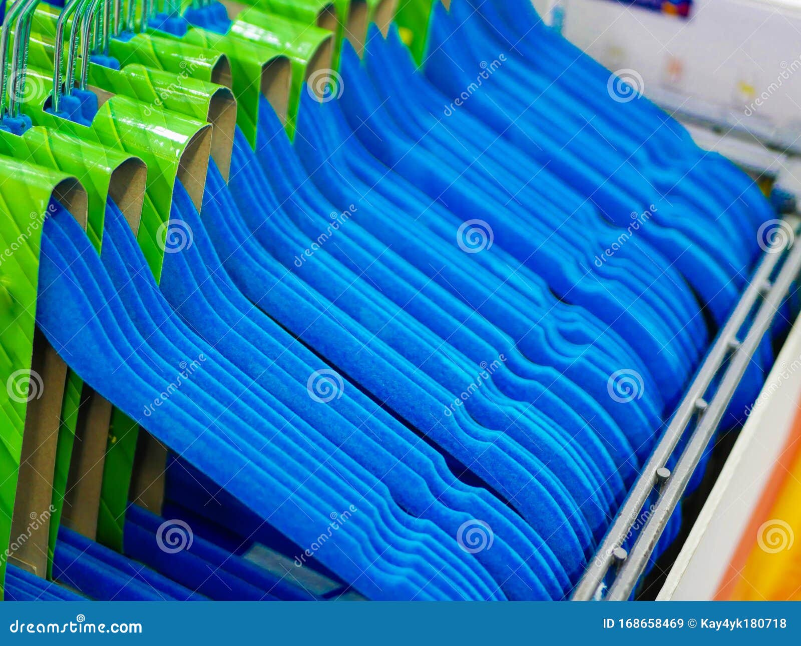 Blue Hangers. a Row of Blue Velor Clothes Hangers Stock Image - Image ...