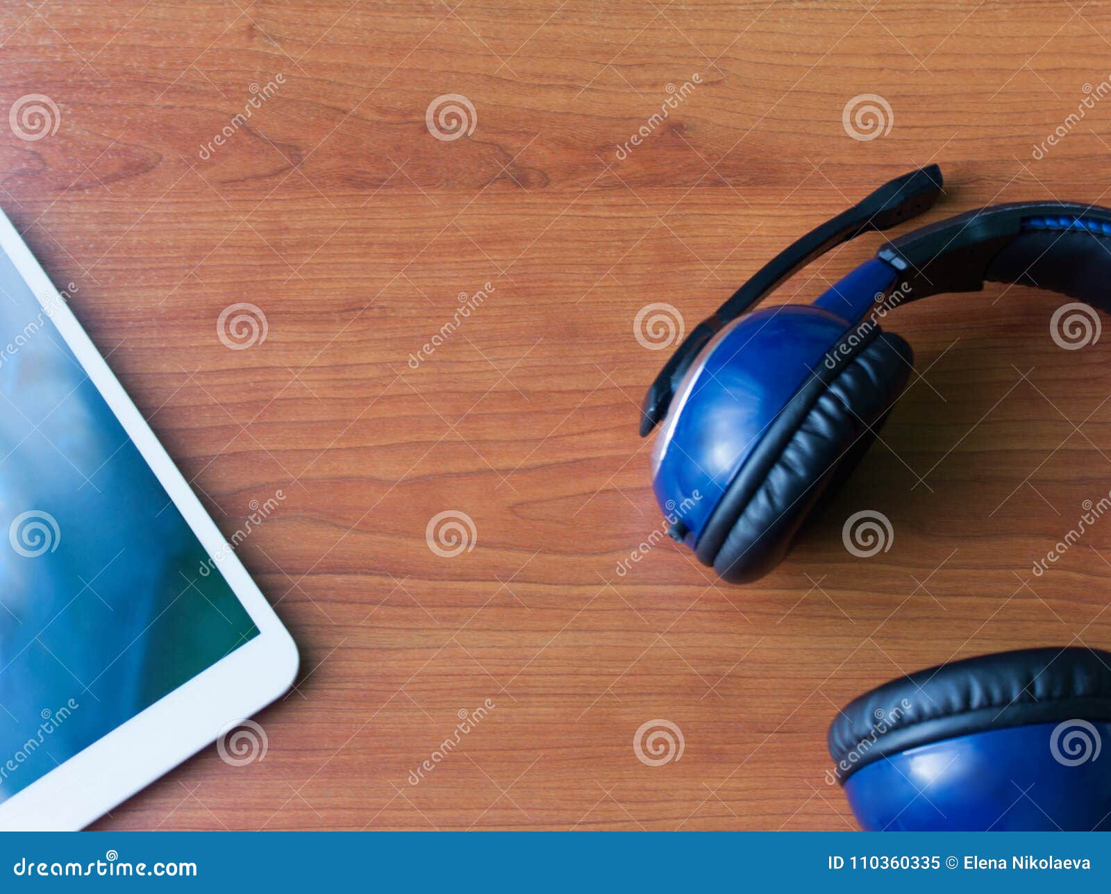 Blue Headphones and Tablet on the Table Stock Image - Image of desk ...