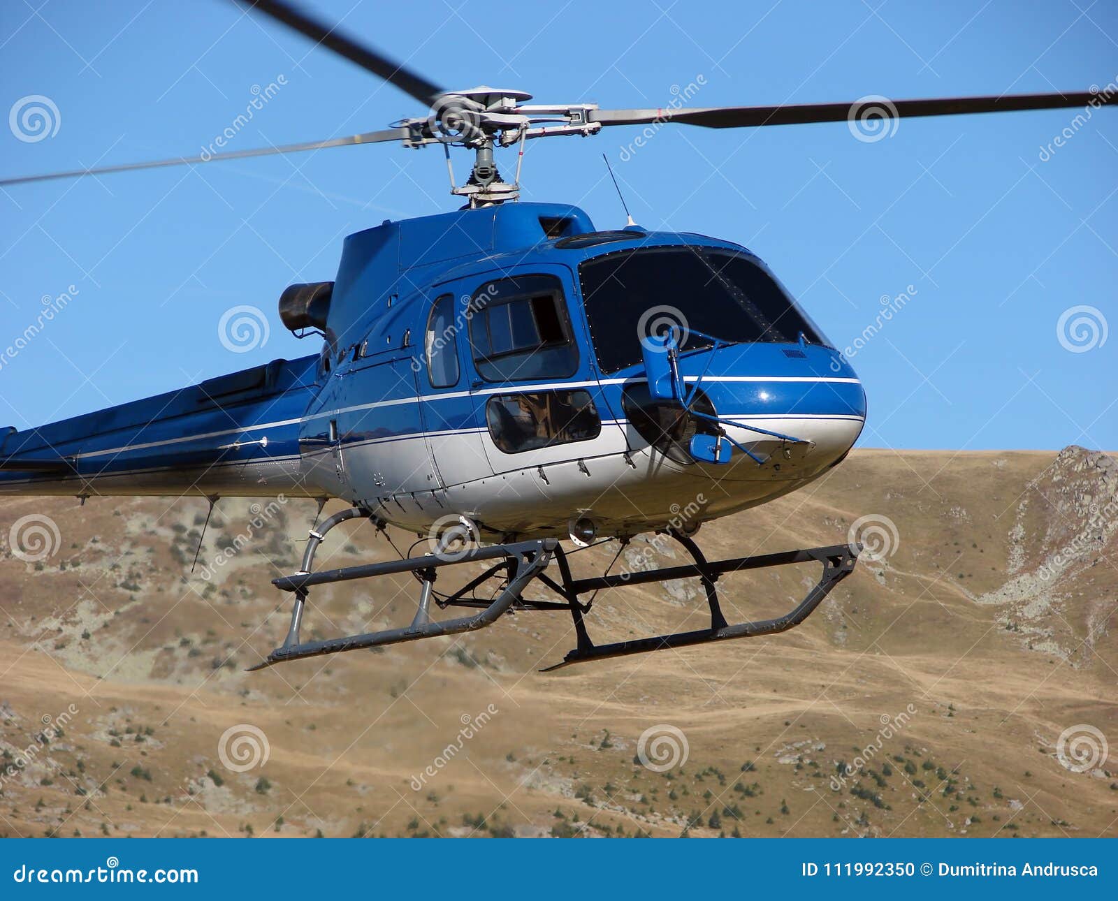 Blue helicopter flying stock photo. Image of propeller - 111992350