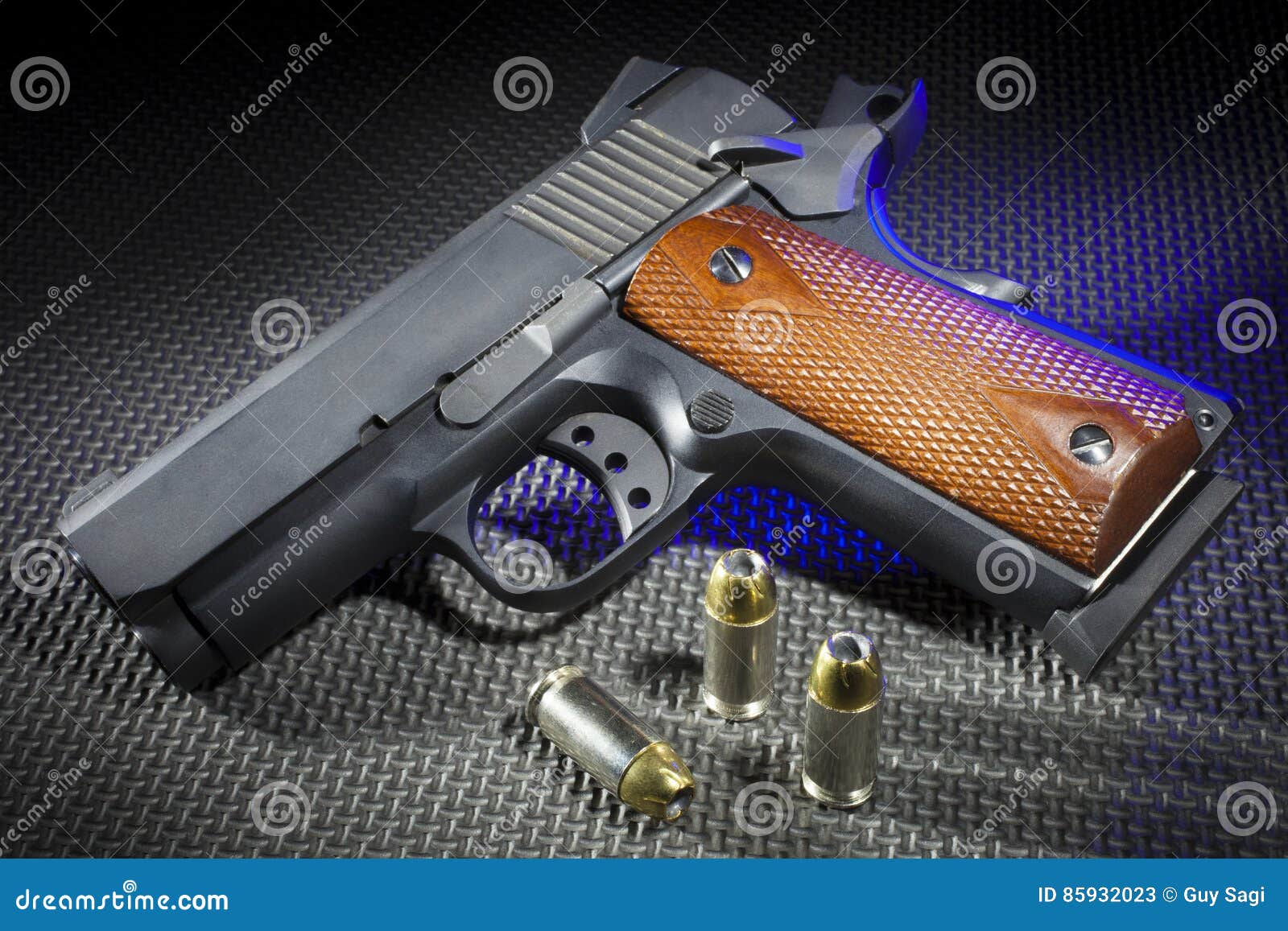 Blue Highlighted Handgun and Ammo Stock Image - Image of metal, handgun ...