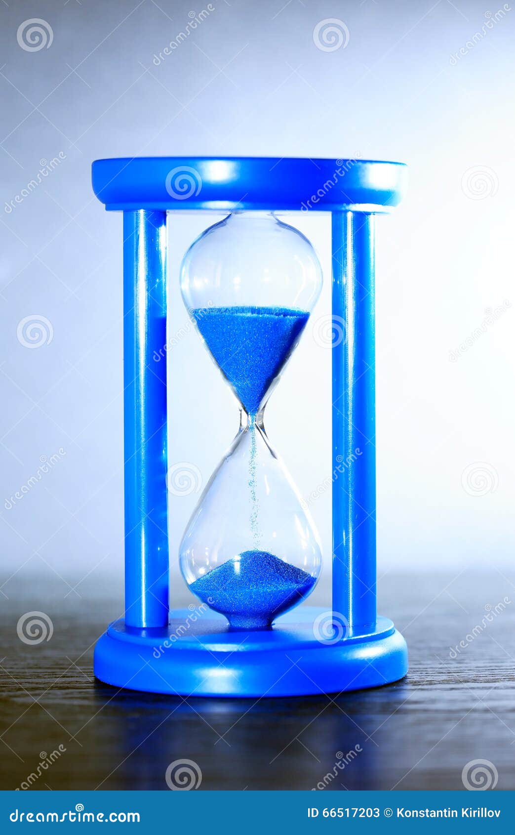 Blue Hourglass Closeup stock image. Image of silhouette - 66517203