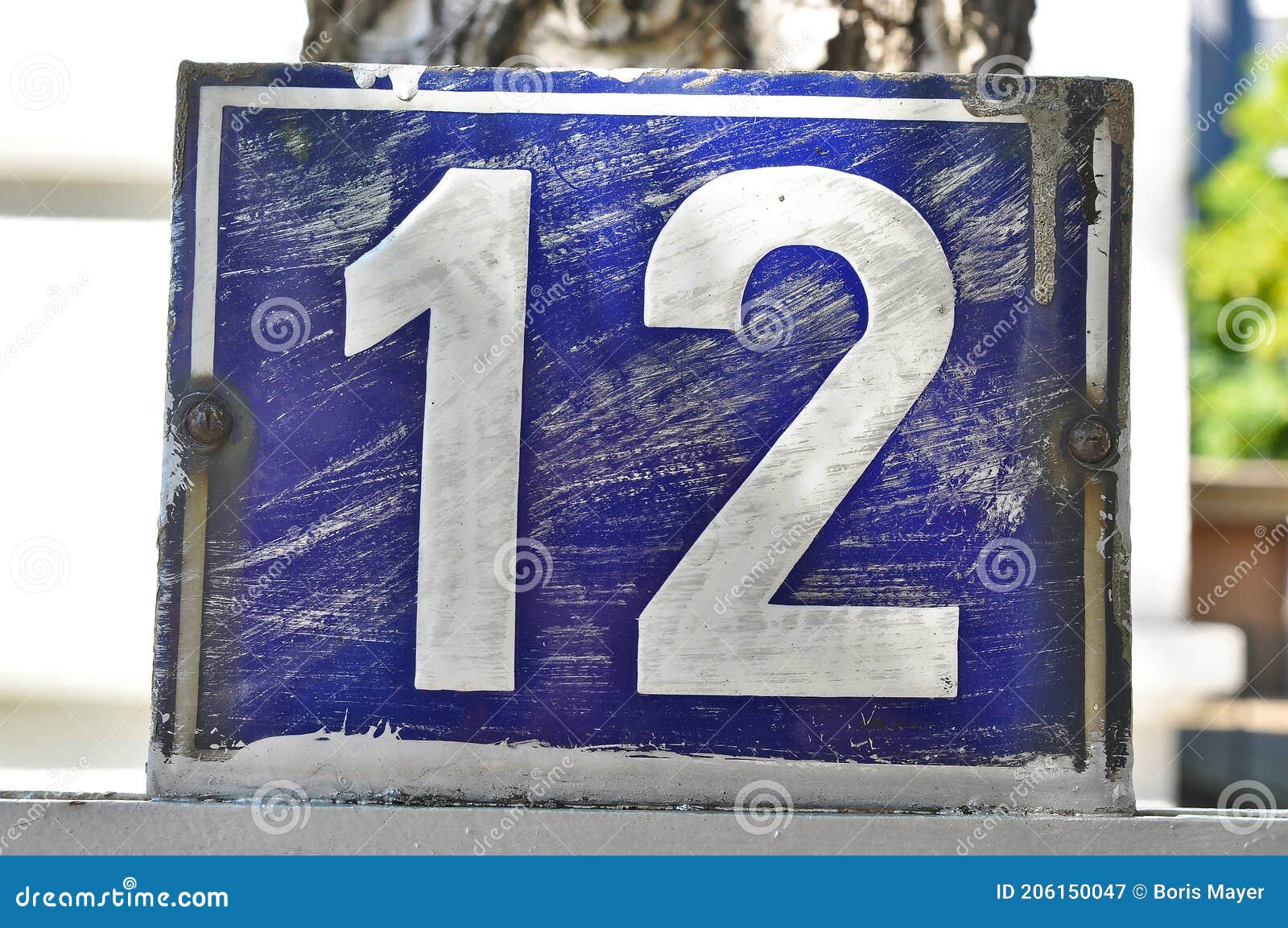 A Blue House Number Plaque, Showing the Number Twelve Stock Image ...