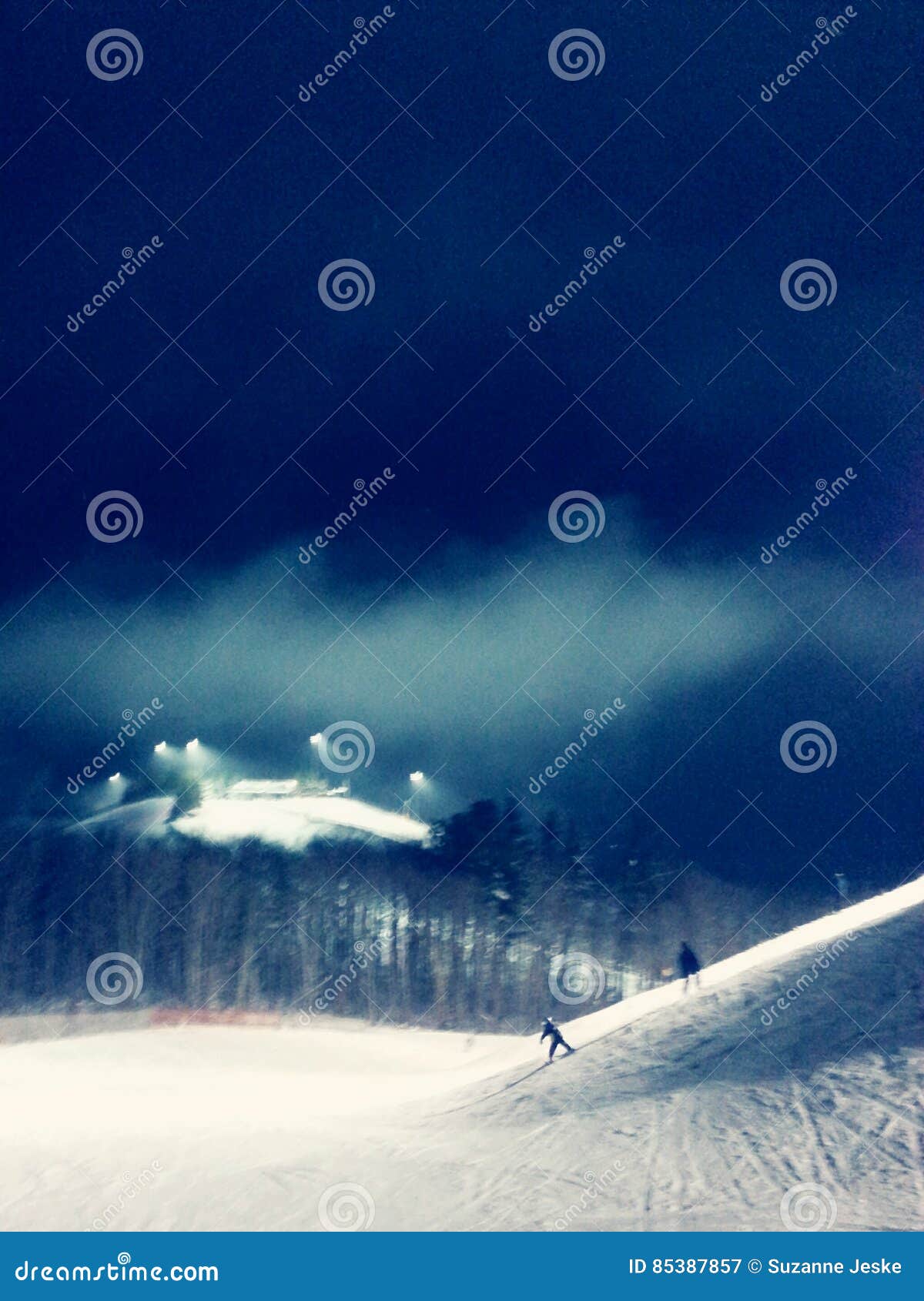 Night Skiing Adventure: Male Skier Illuminated By Stunning Lights On ...