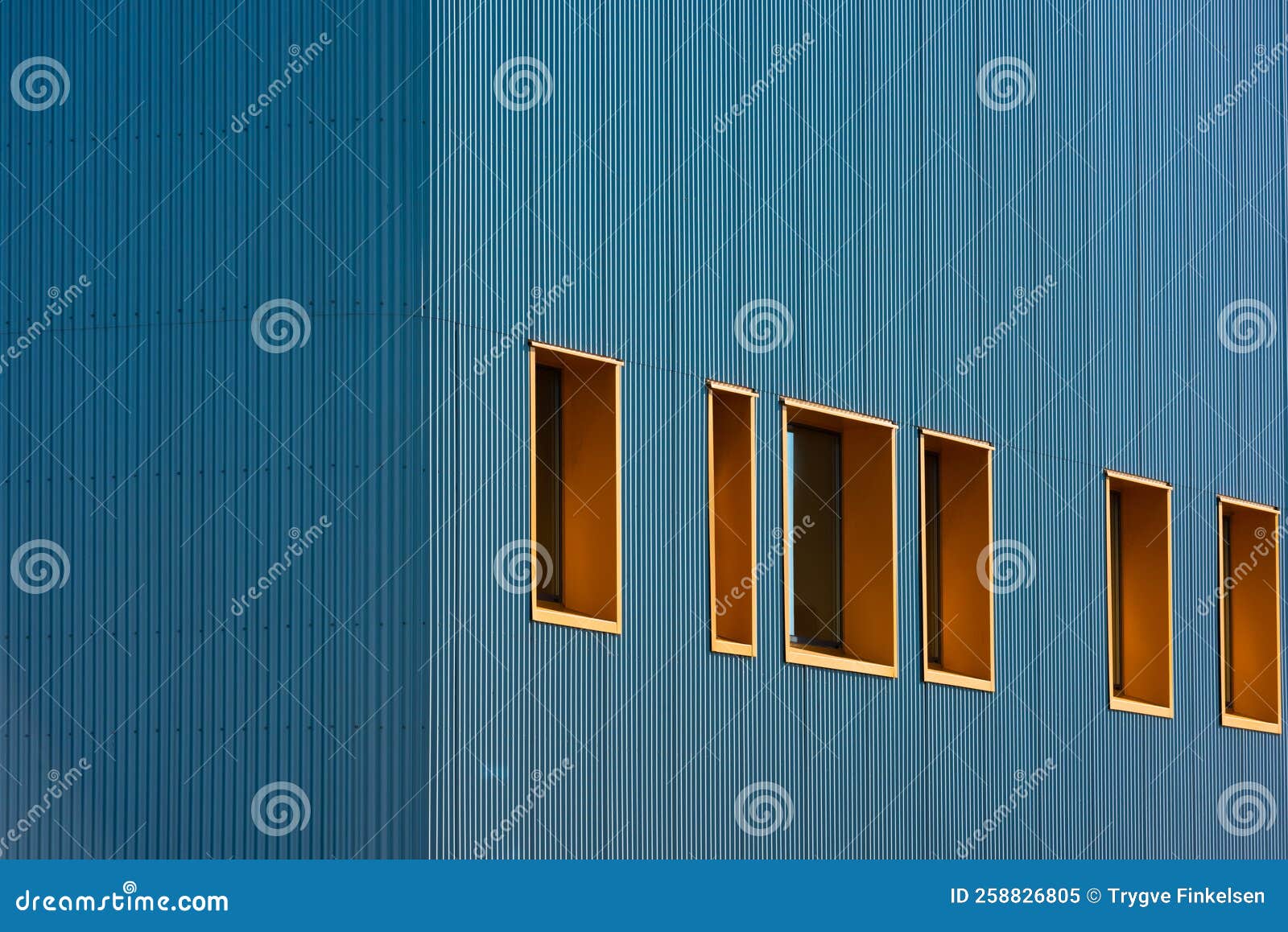 Blue Industrial Warehouse with Yellow Window Frames.. Stock Image ...