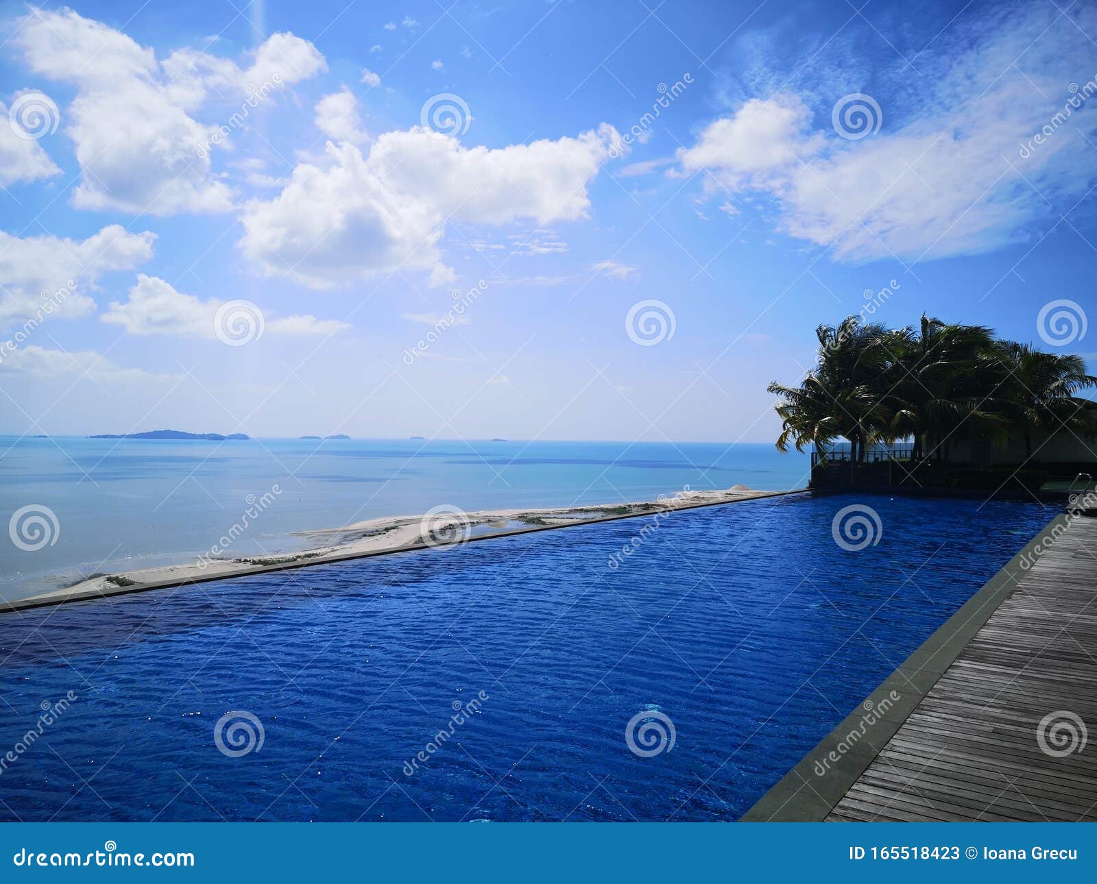 Infinity Pool and Ocean with Blue Sky and White Clouds Stock Image ...