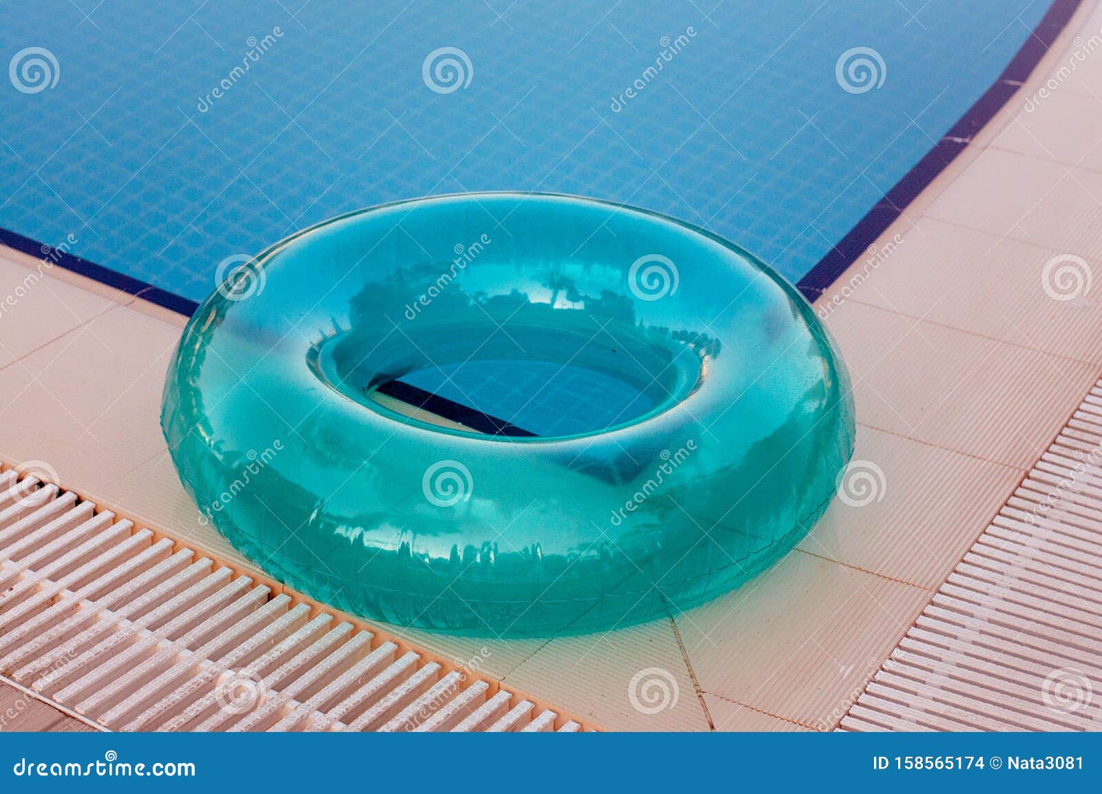 Blue Inflatable Ring Near the Pool with Water. Safety on the Water ...
