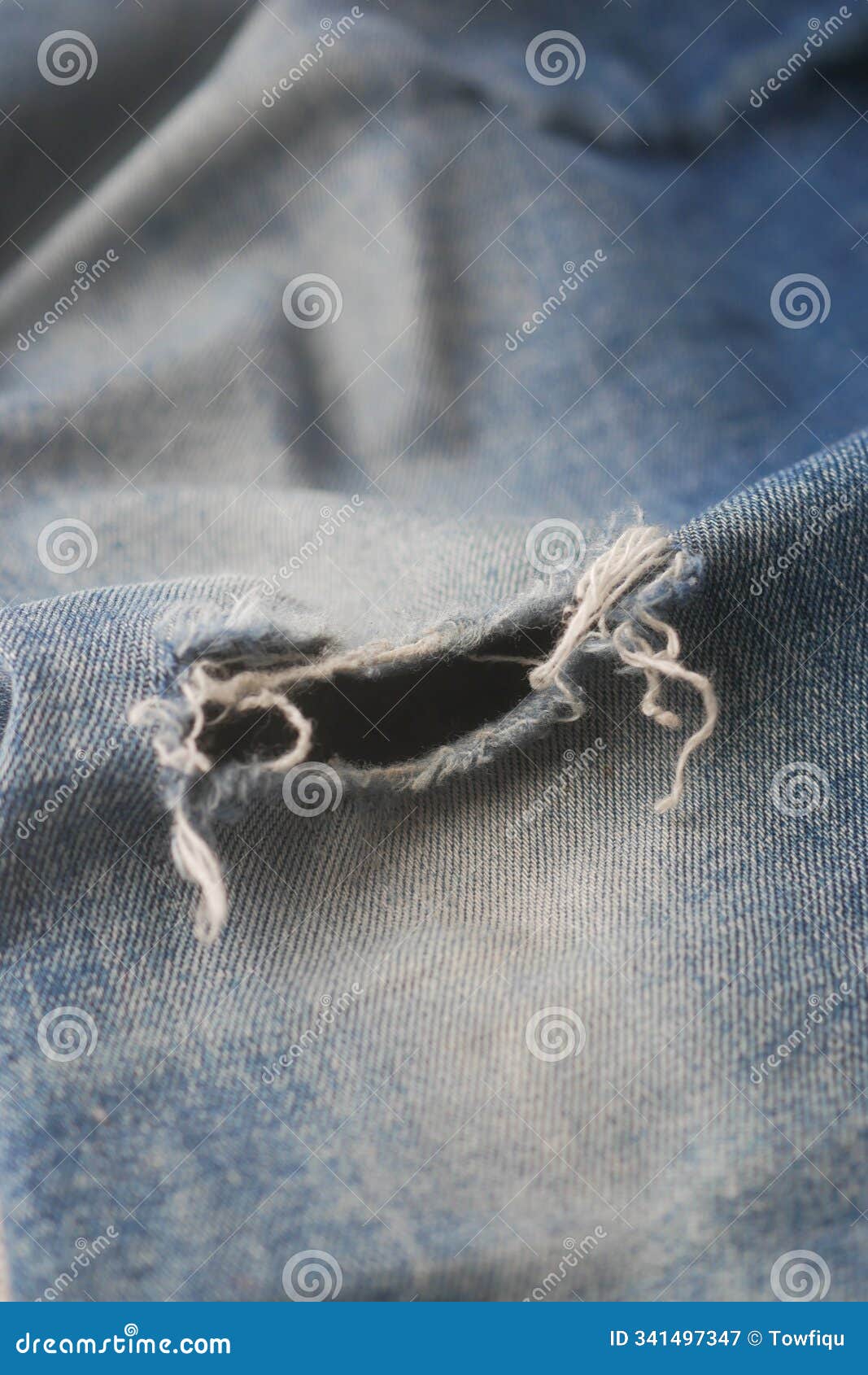 Blue Jean Texture with a Hole and Ripped Threads Showing Stock Image ...