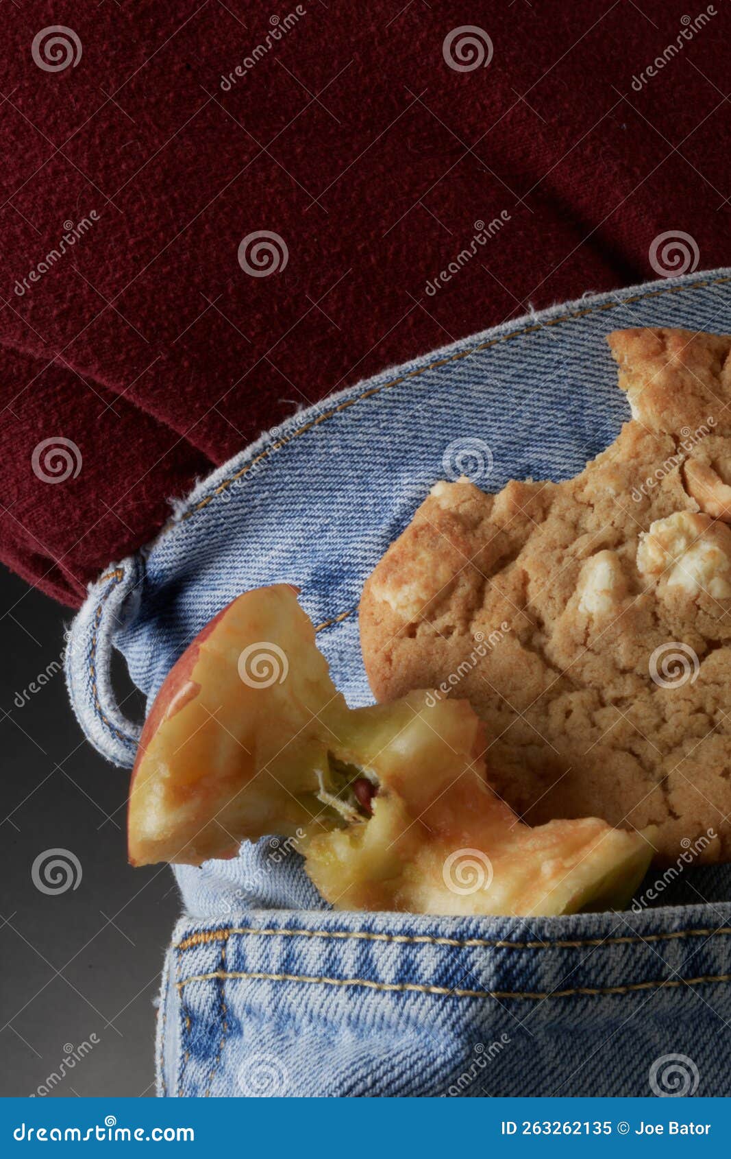 Apple Core and Cookie Stuffed into Pants Pocket Stock Image - Image of ...