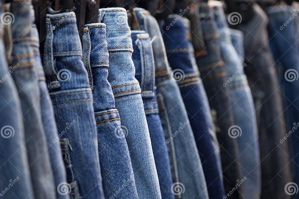 Blue jeans in a shop stock image. Image of fashion, closet - 18436765
