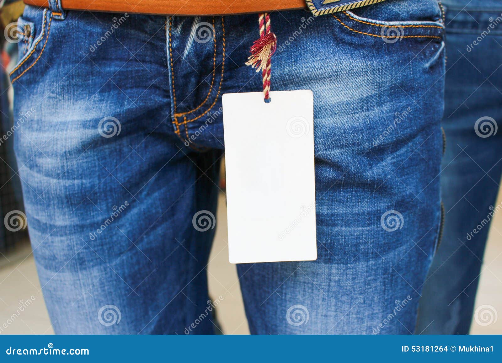 Blue Jeans with a White Paper Label Stock Photo - Image of belt, label ...