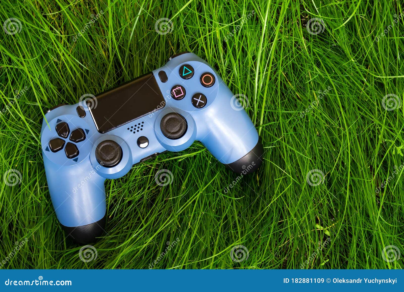 A Blue Joystick from a Game Console on Green Grass Editorial Stock ...