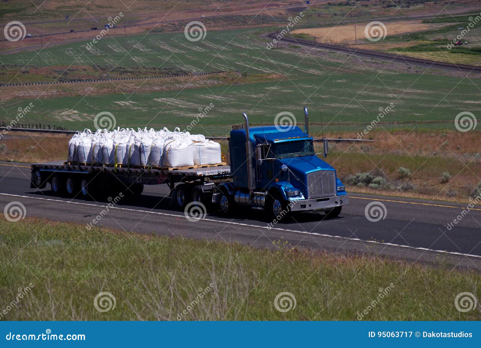Blue Kenworth / Loaded Flatbed Stock Image - Image of tractor, lighting ...
