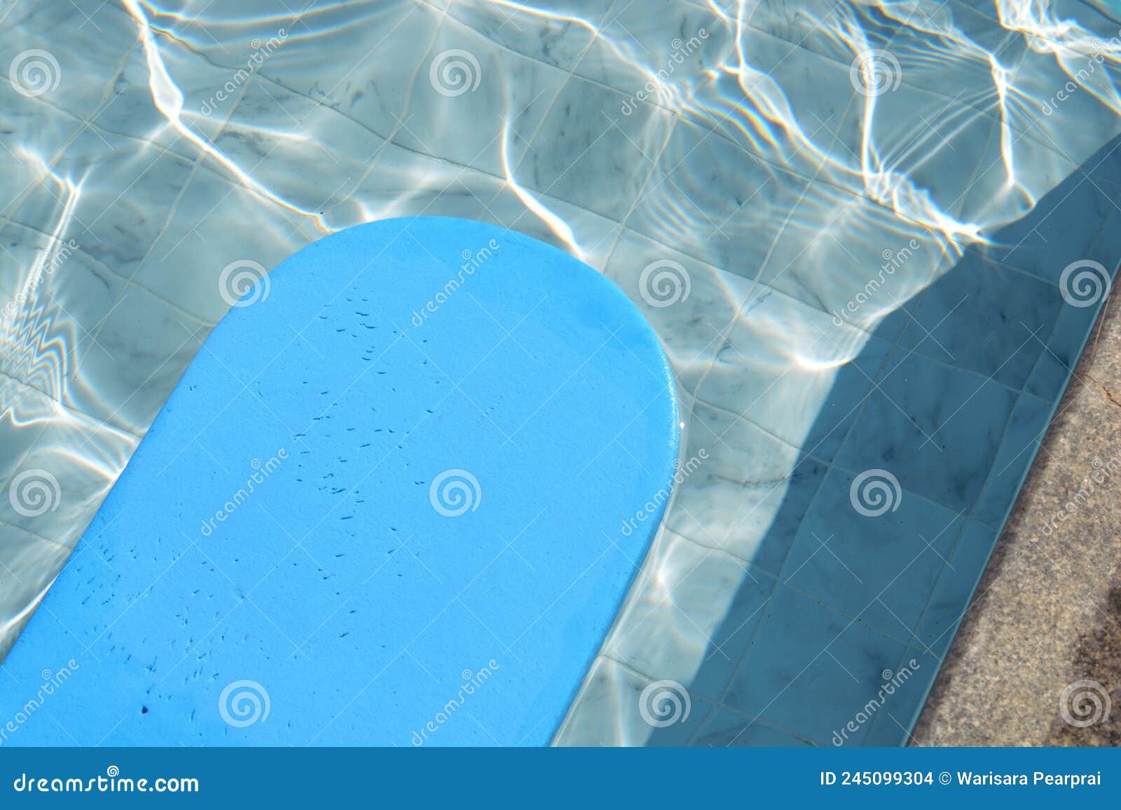 Blue Kickboard Floating on Swimming Pool Water Surface Stock Photo ...