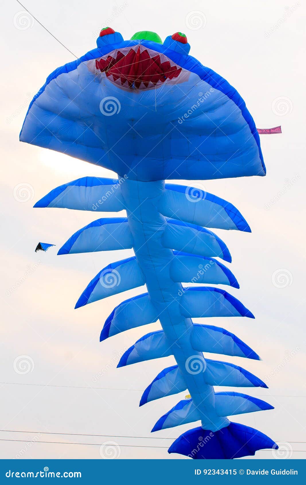 Blue kite that is flying stock image. Image of bone, kite - 92343415