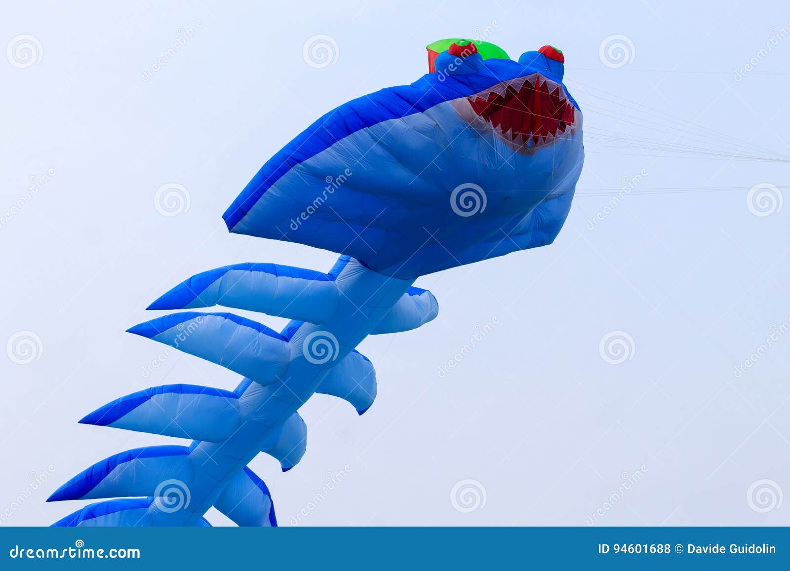 Blue kite that is flying stock photo. Image of kite, fish - 94601688