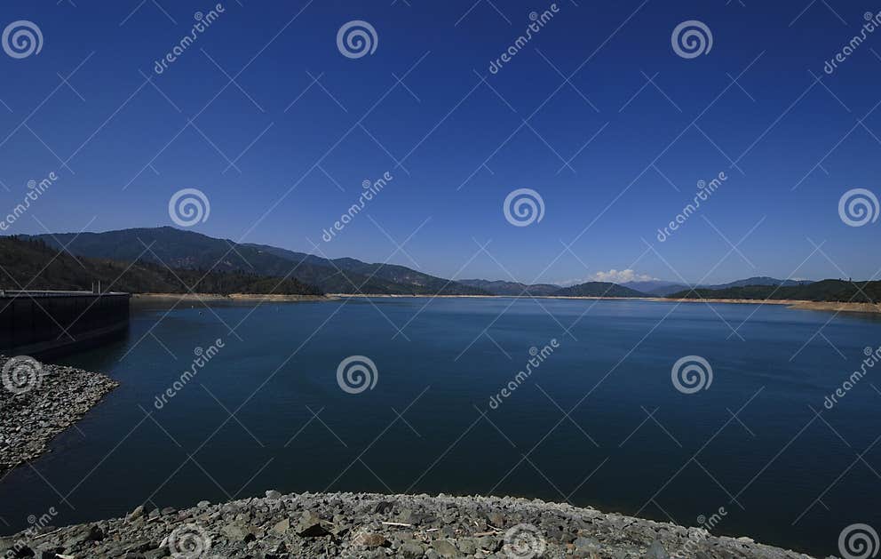 Blue Lake and Sky at a Dam stock image. Image of landmark - 26225749
